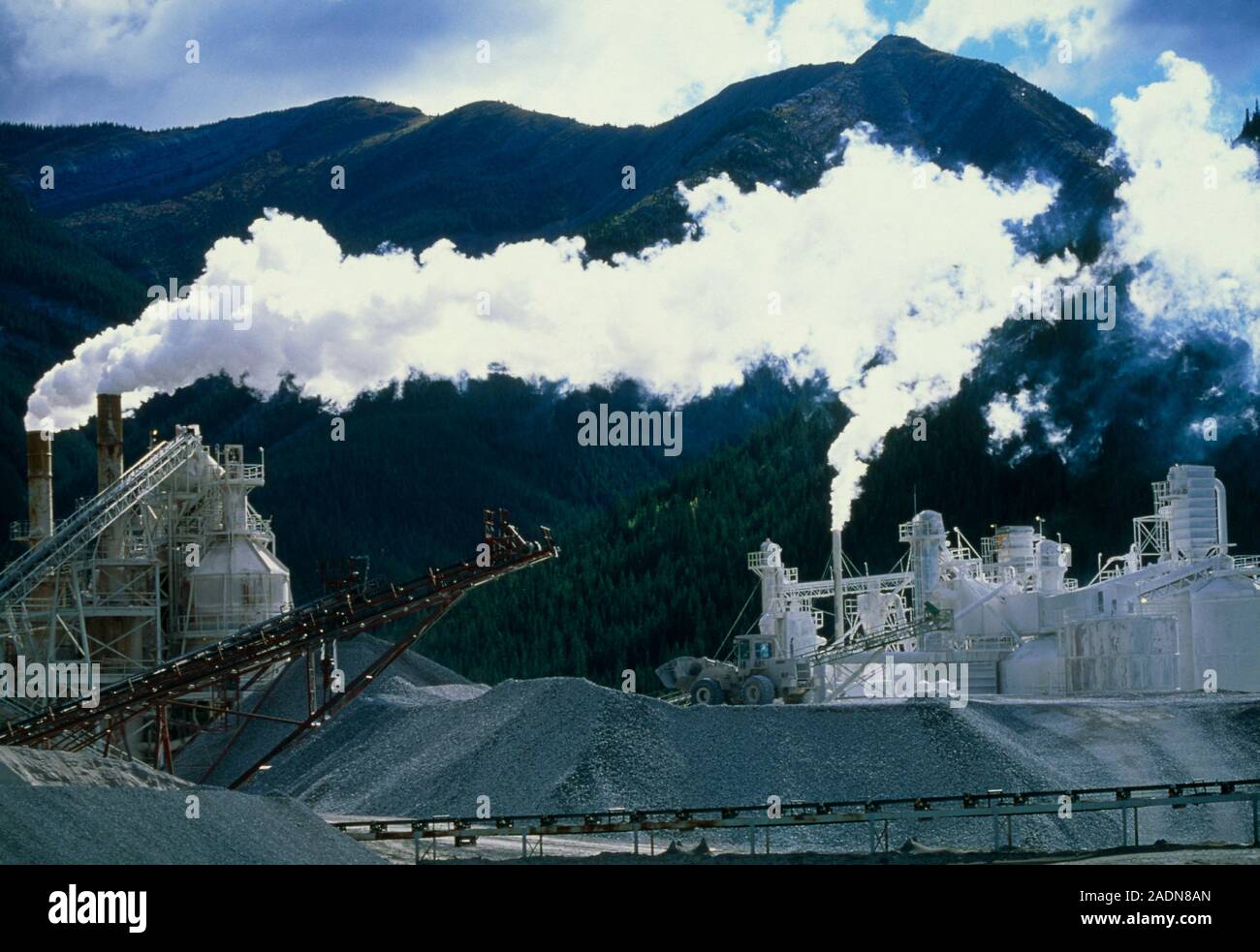 Cement works. Smoke coming from the chimneys of a cement works. Cements ...