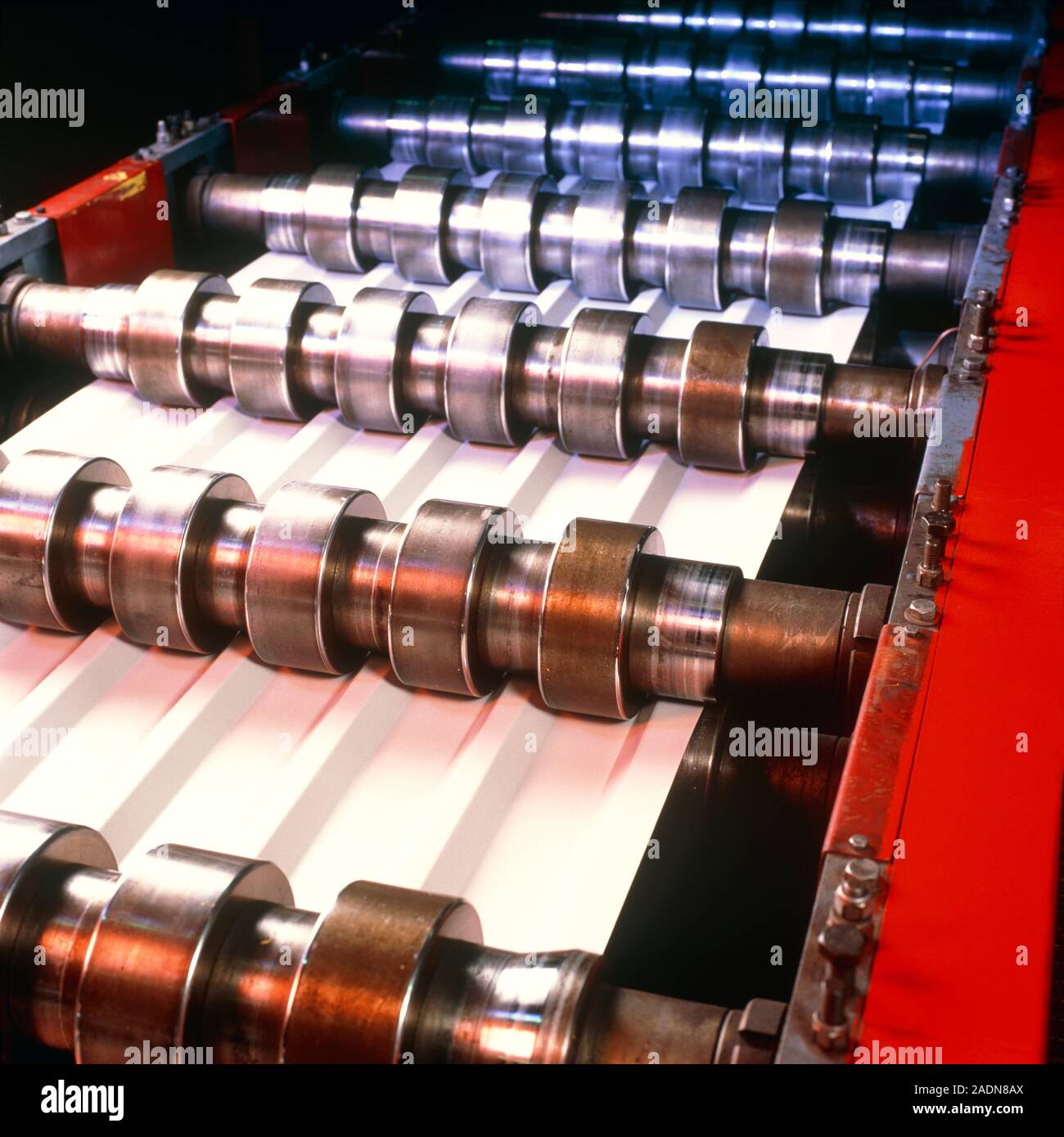Sheet metal production. Rollers rolling out sheet metal during its ...