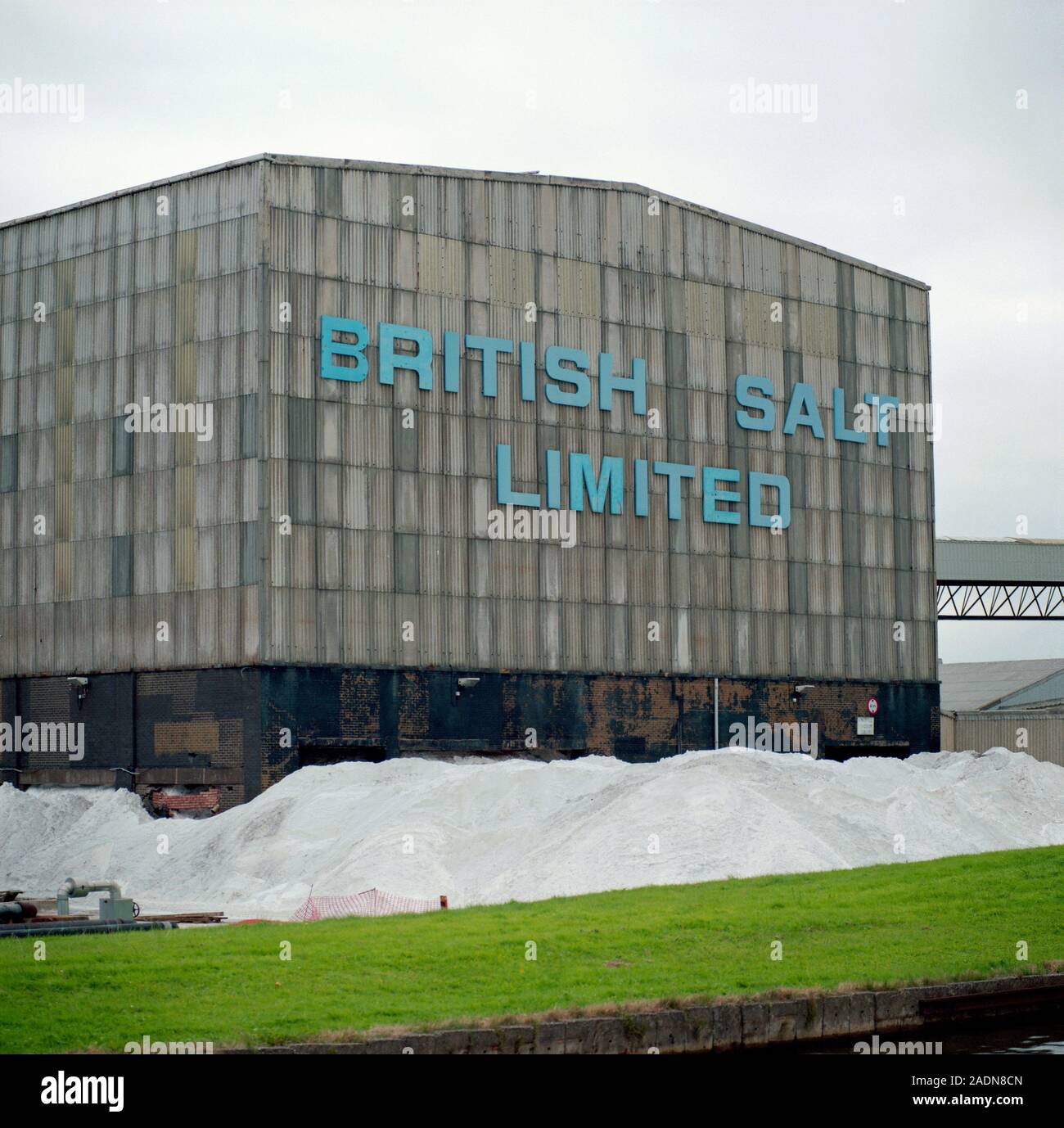 Salt works. Building surrounded by piles of salt. Photographed at ...