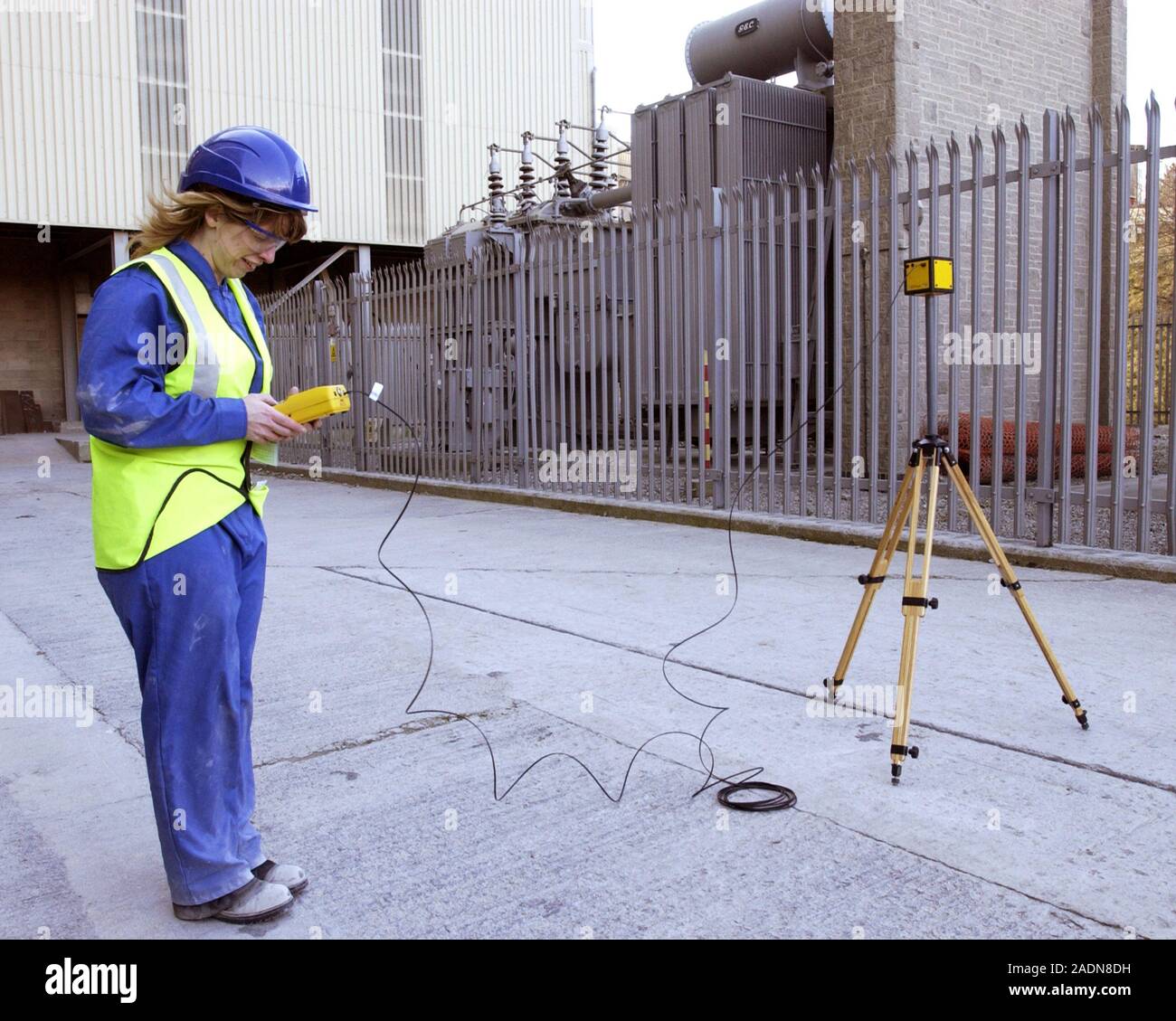 MODEL RELEASED. Electromagnetic field measurement. Scientist using a ...