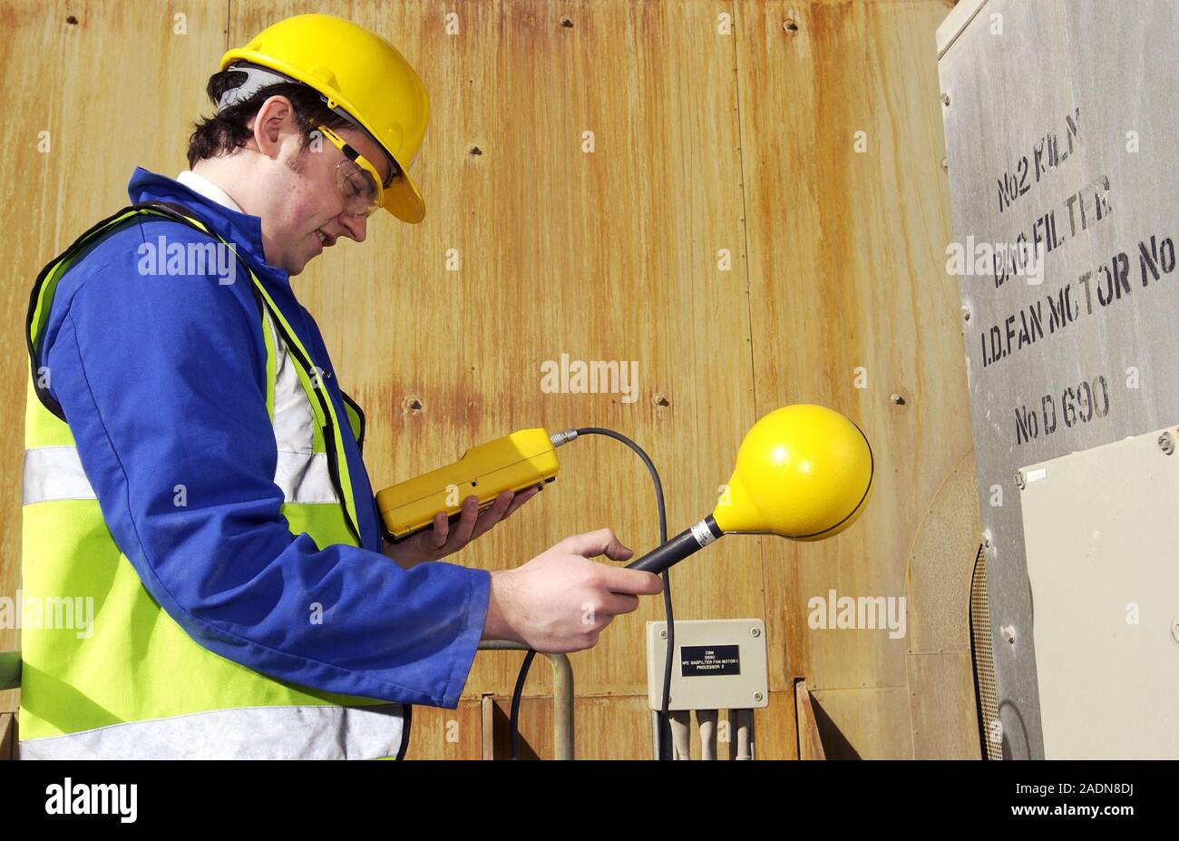 MODEL RELEASED. Electromagnetic field measurement. Scientist using a ...