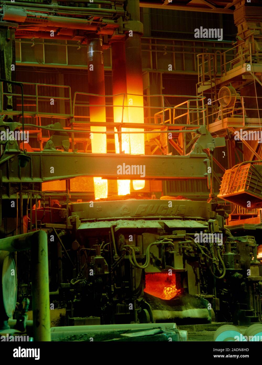 Three graphite electrodes glow red hot after their removal from an ...