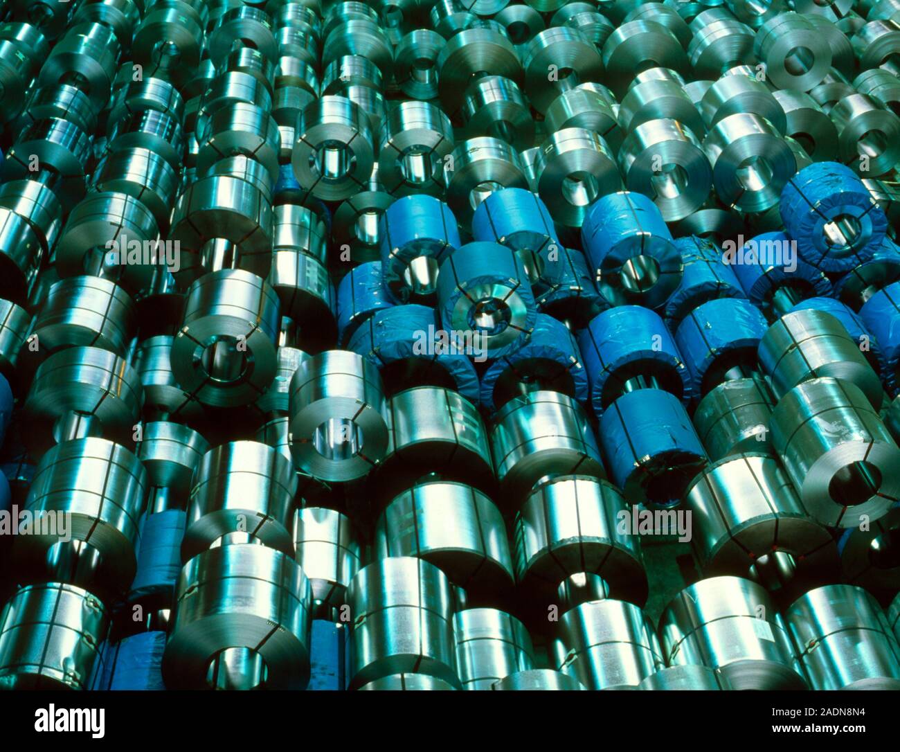 Steel store. Rolls of refined sheet steel stored in a warehouse. Steel ...