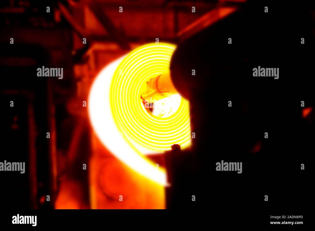 Glowing hot steel roll at a steel mill. Hot rolling, passing hot steel ...