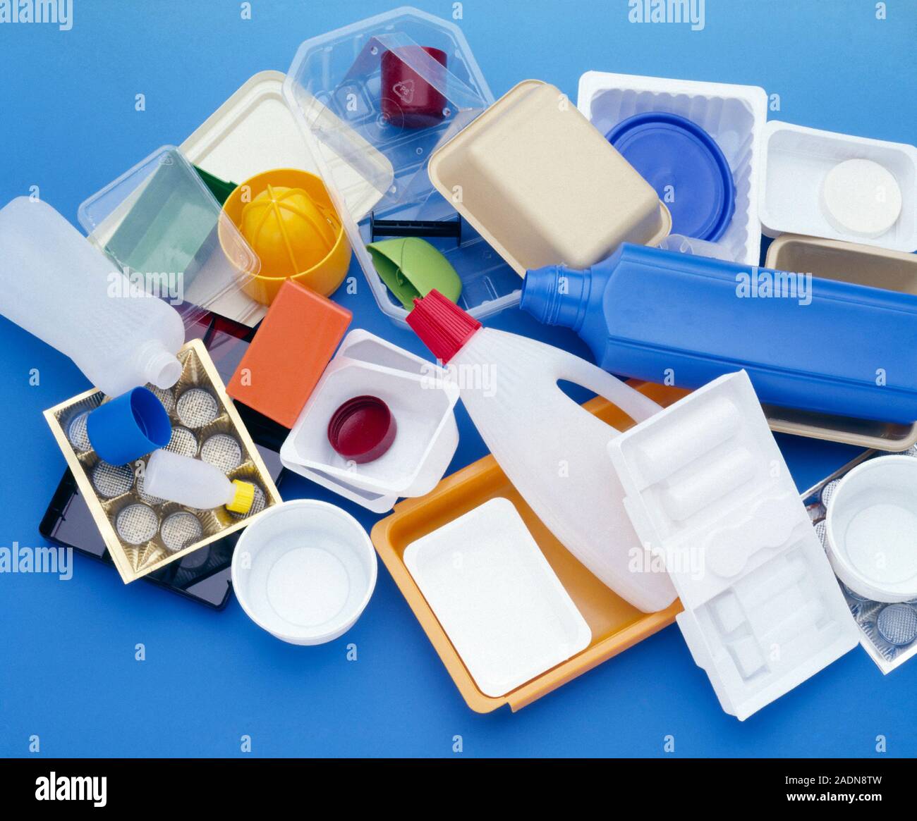 Plastic for recycling. Jumble of brightly-coloured empty plastic ...