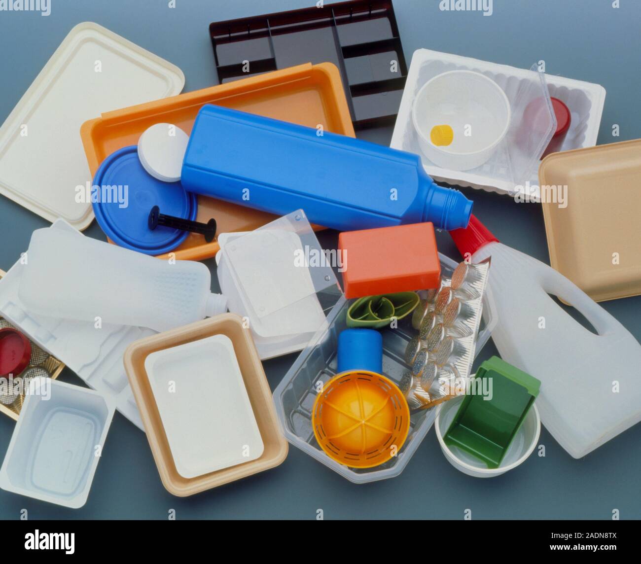 Plastic for recycling. A jumble of brightly col- oured, empty plastic ...