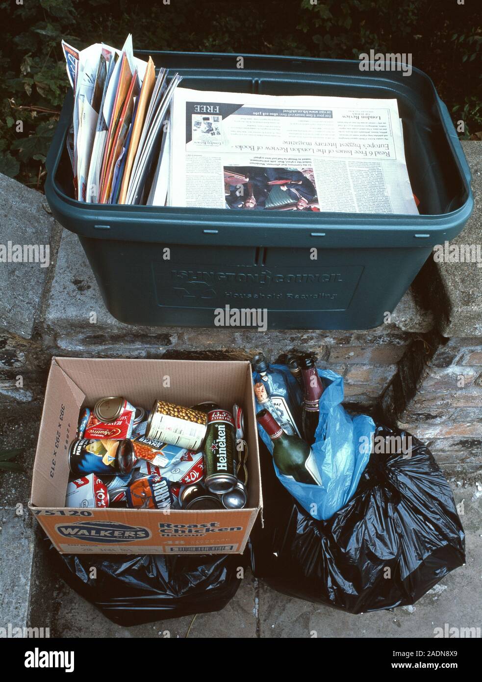 Household recycling. Bags and boxes of household waste ready for ...
