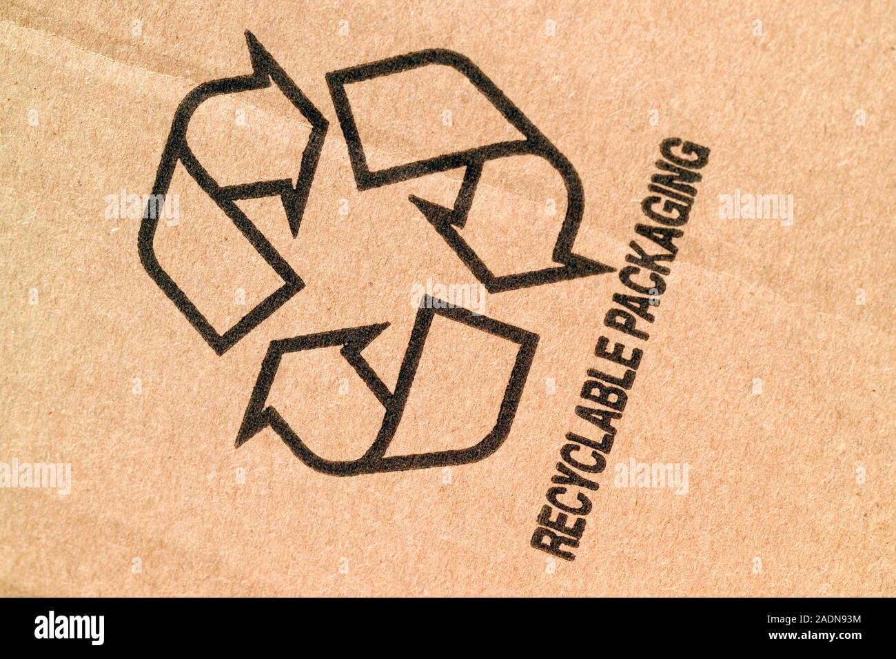 Recycling symbol on cardboard packaging Stock Photo - Alamy