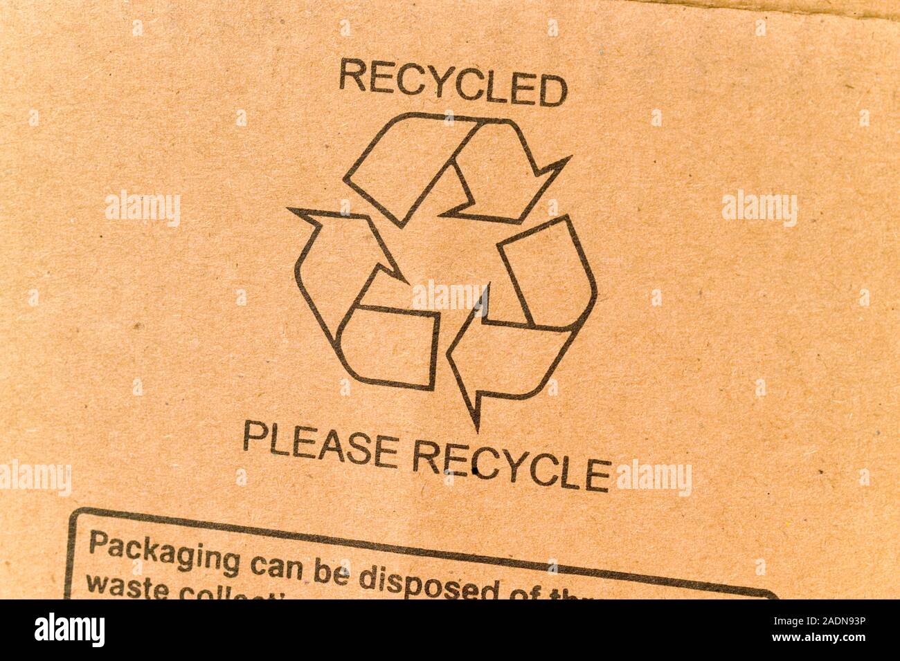 Recycling symbol on recycled cardboard packaging Stock Photo - Alamy