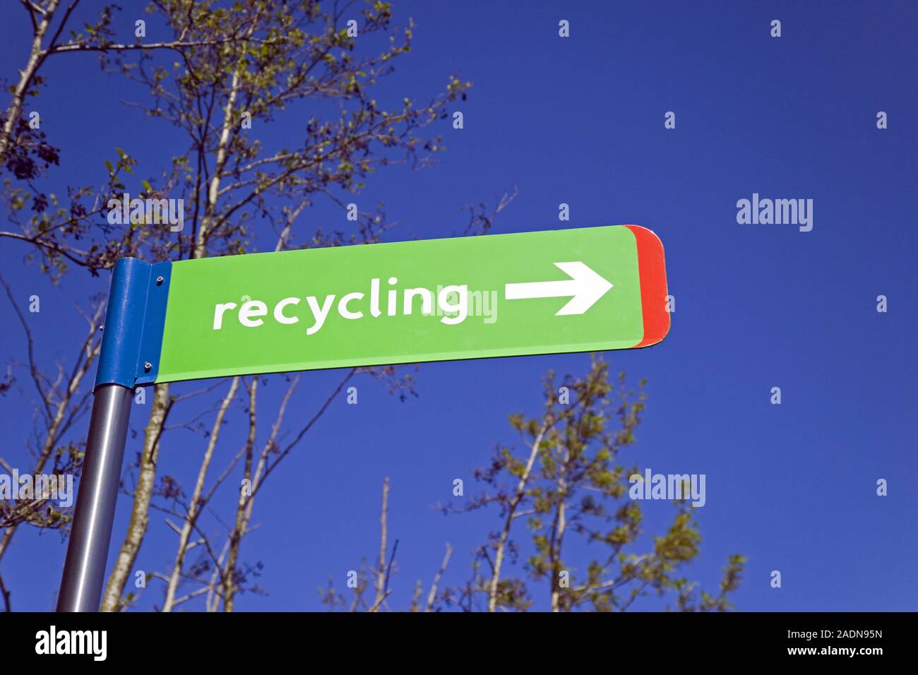 Recycling sign indicating the location of a a recycling collection ...