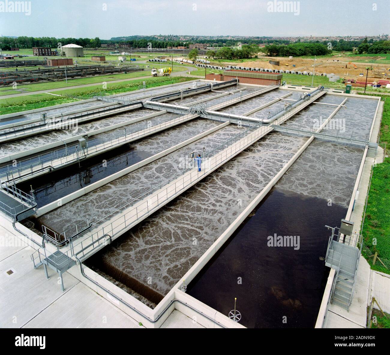 Sewage works. Aerial view of aeration tanks at a sewage works. This ...