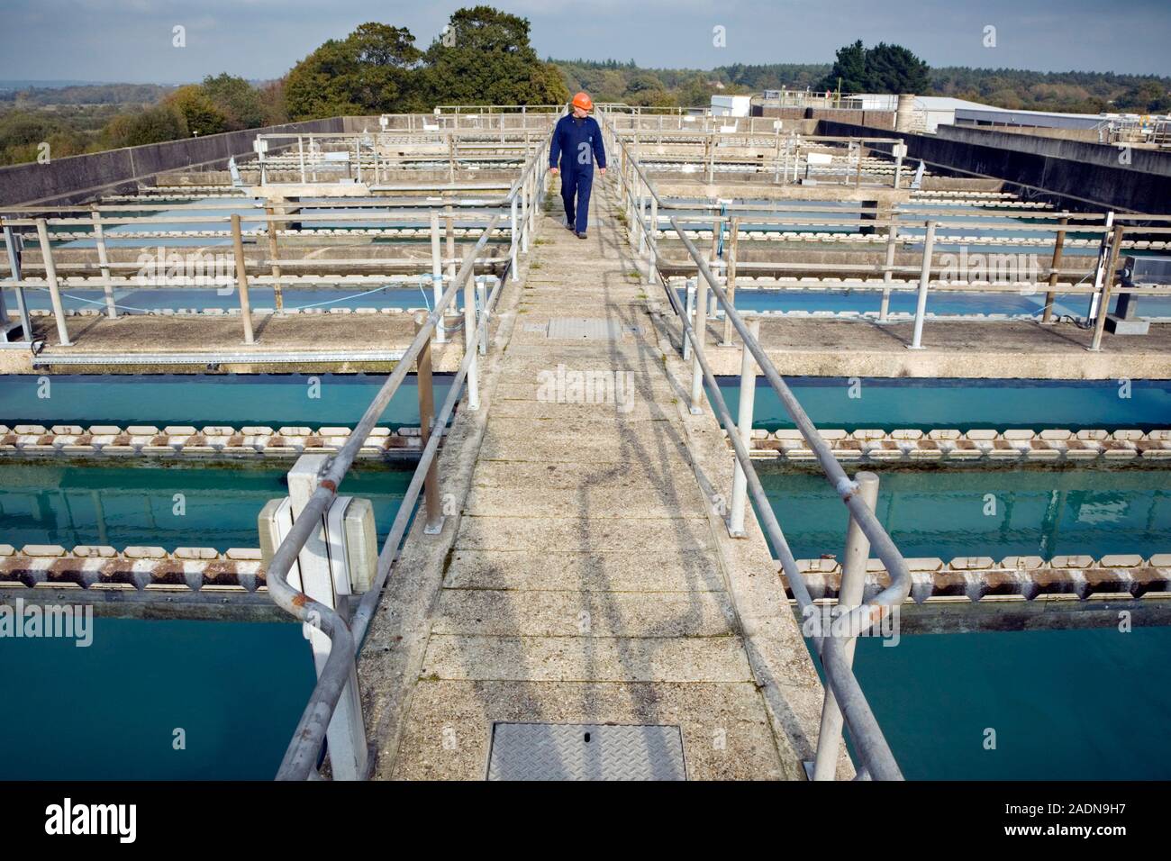 MODEL RELEASED. Water treatment. Worker checking the rapid gravity ...