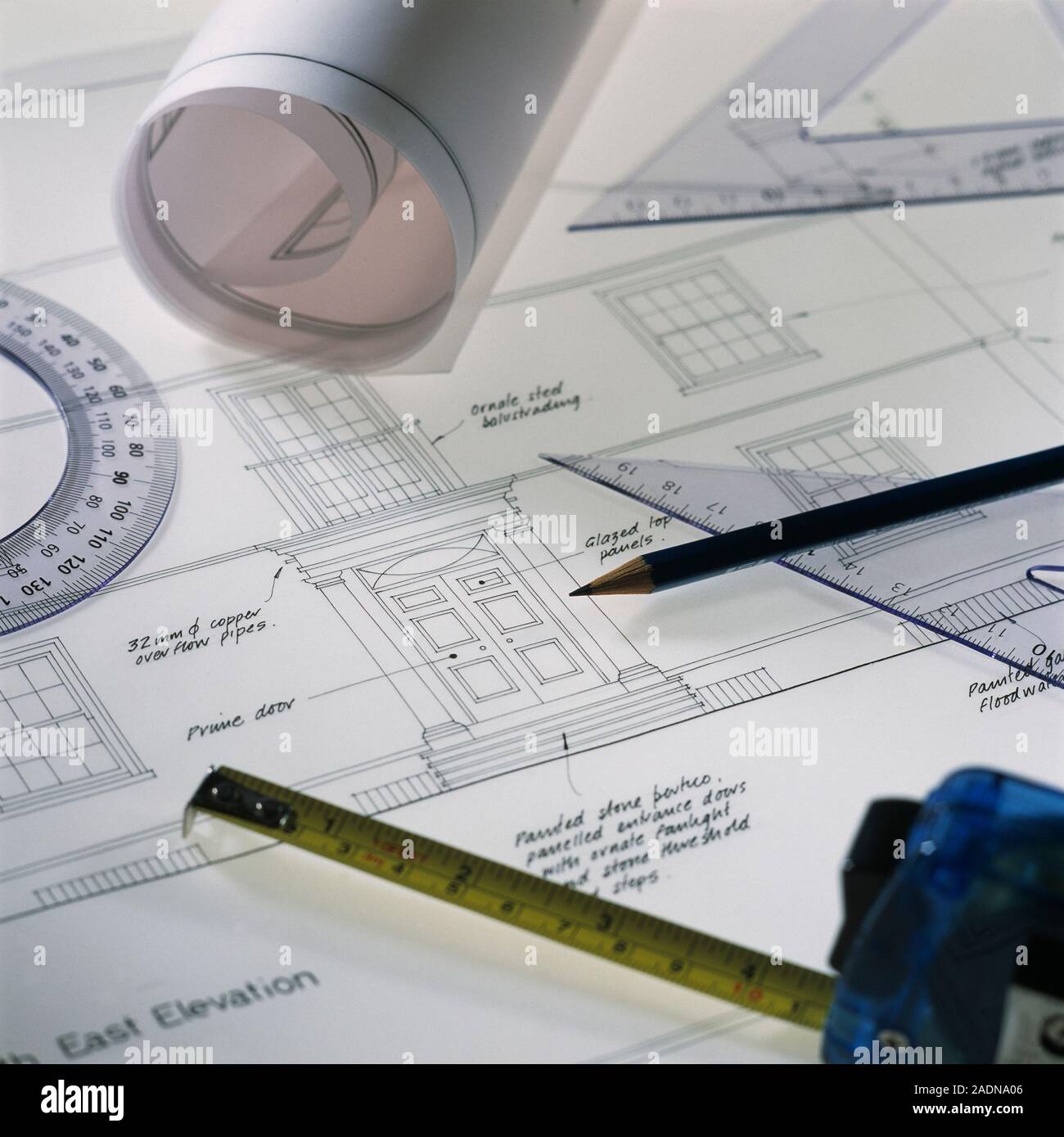 Architectural drawings and equipment used in the design of a house ...