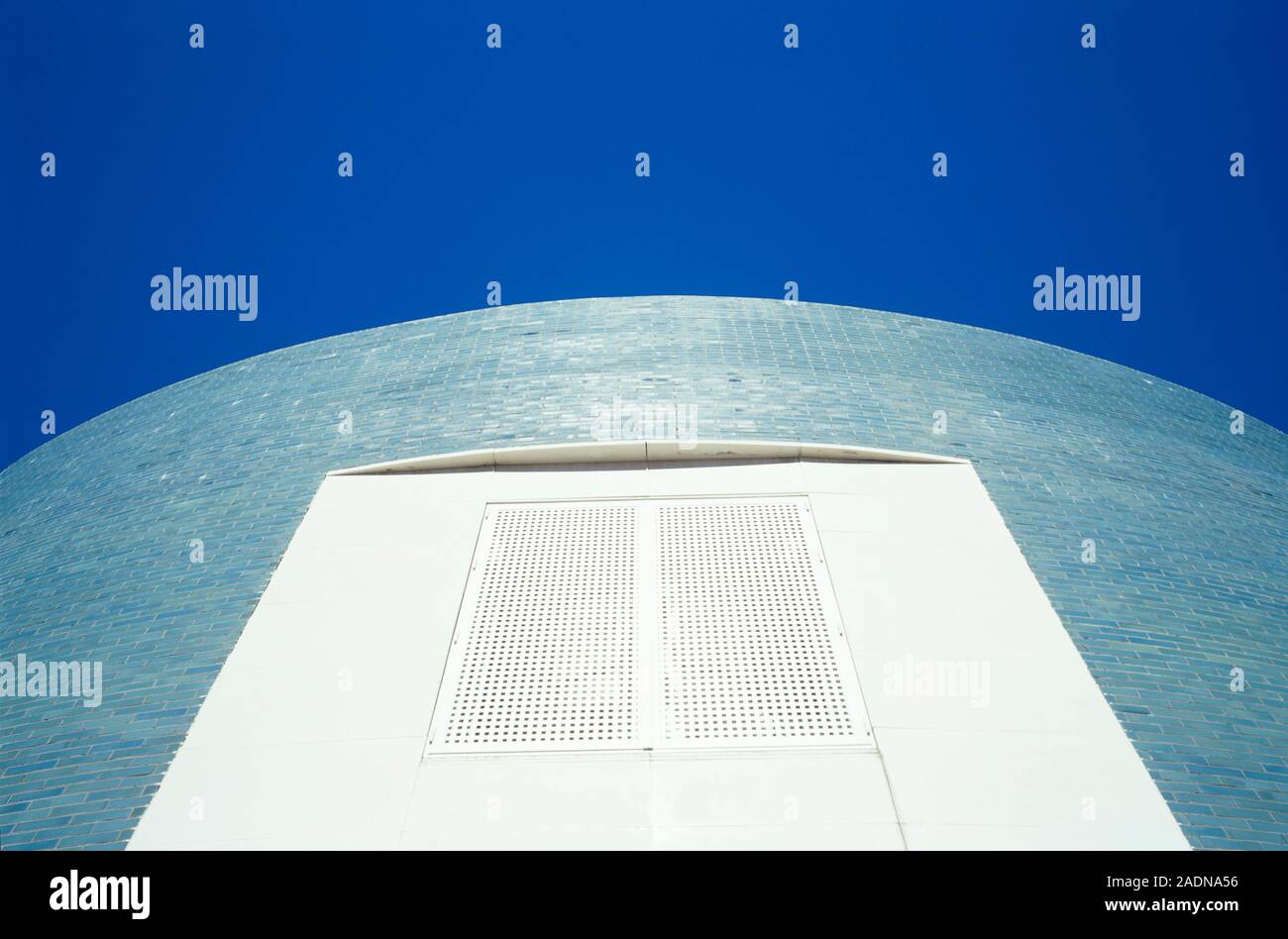 Building architecture. View looking up the side of a curved building ...