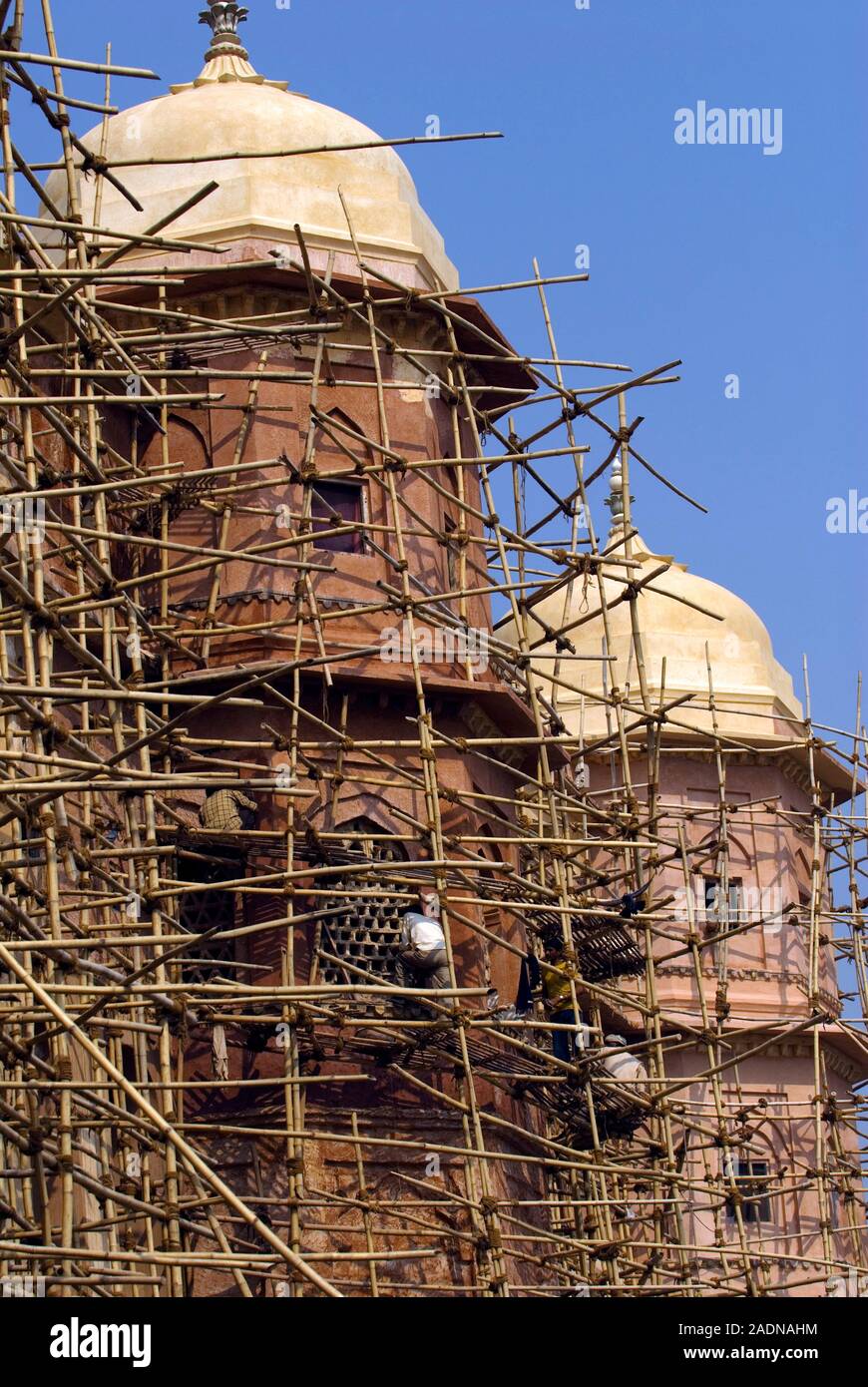 Amber Palace restoration. Construction workers on scaffolding during a UNESCO restoration ...