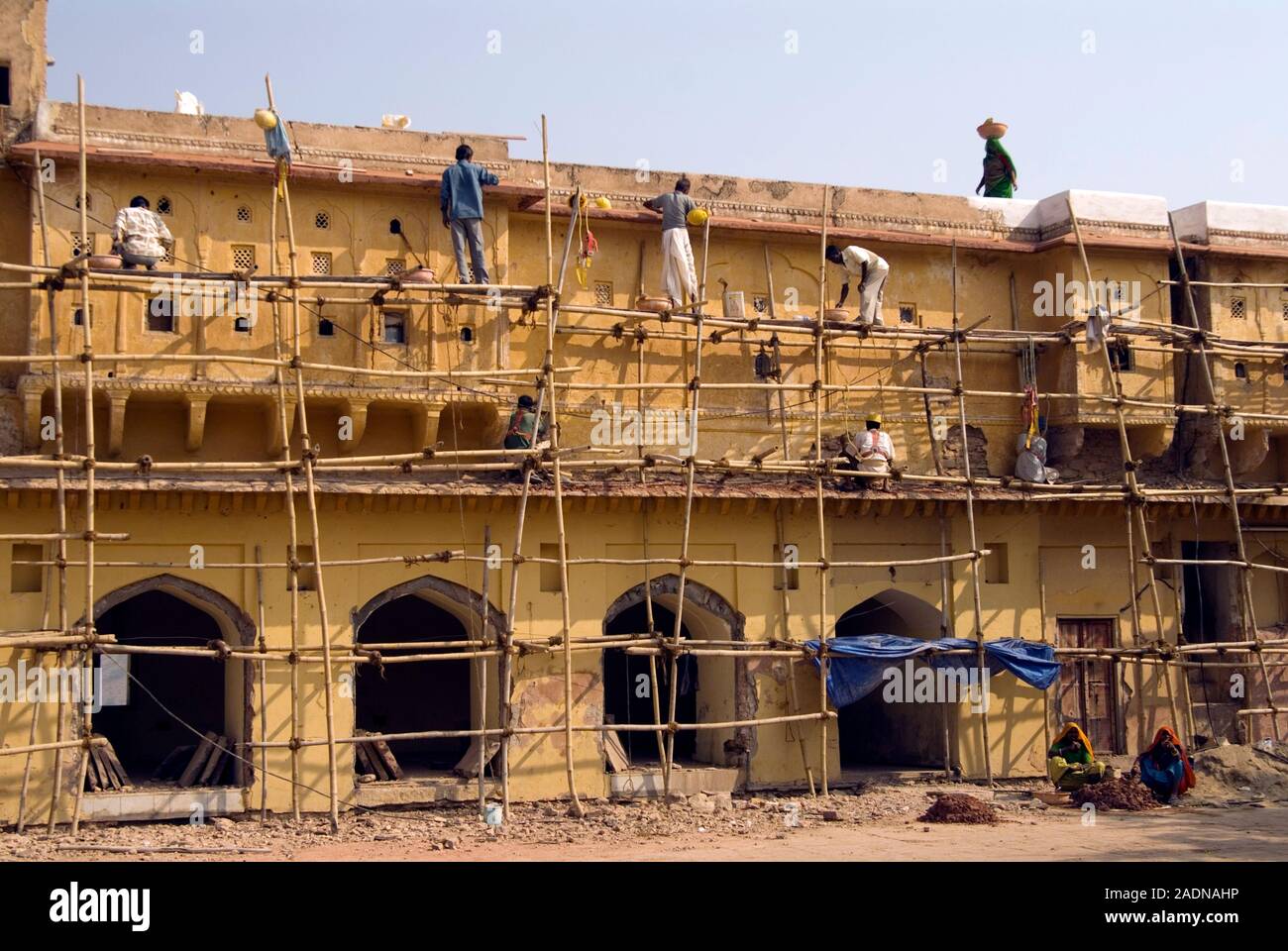 Amber Palace restoration. Construction workers on scaffolding during a UNESCO restoration ...