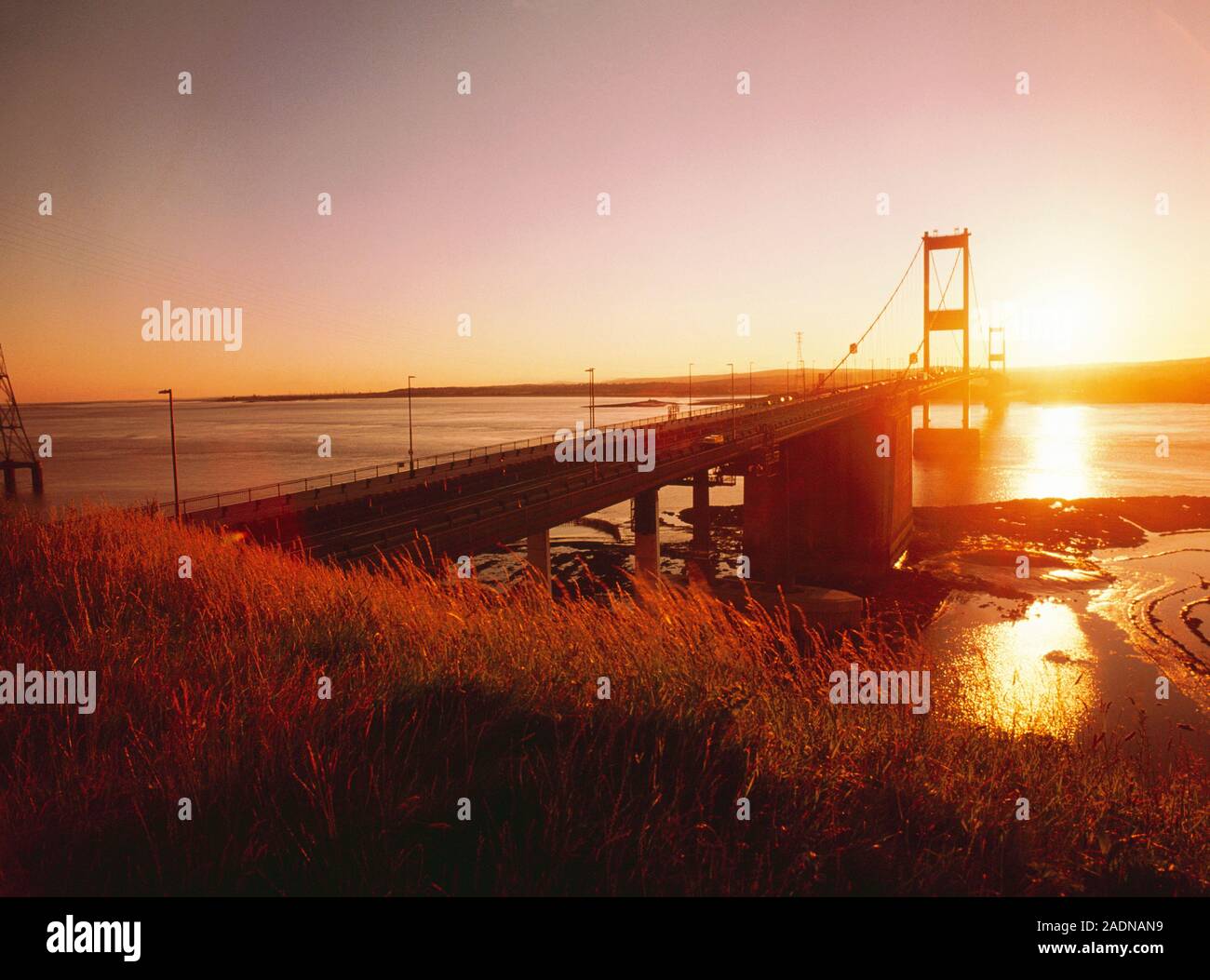 Suspension bridge over the River Severn at sunset. The Severn Bridge ...