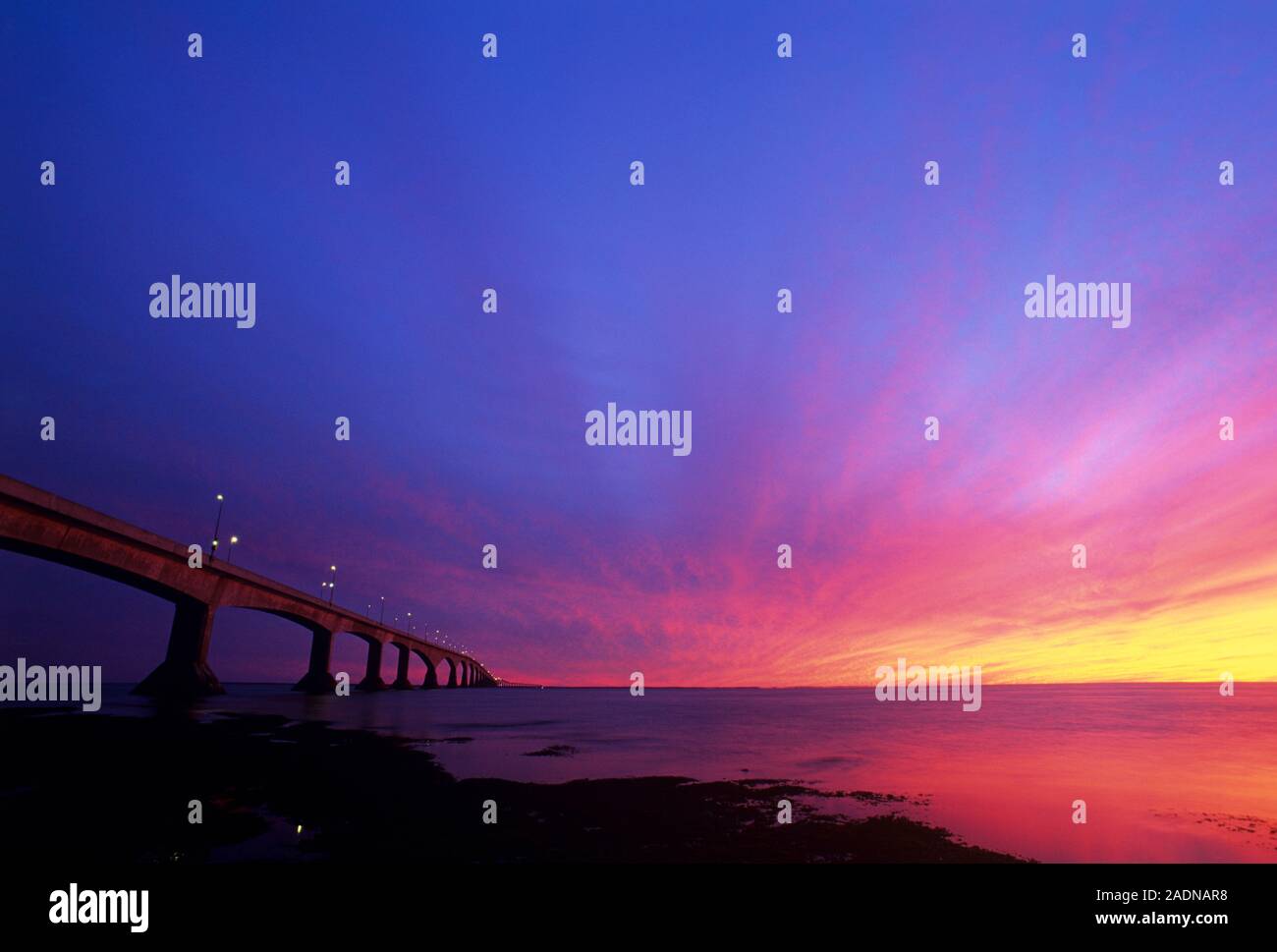 Confederation Bridge at sunset. Confederation Bridge is the longest ...