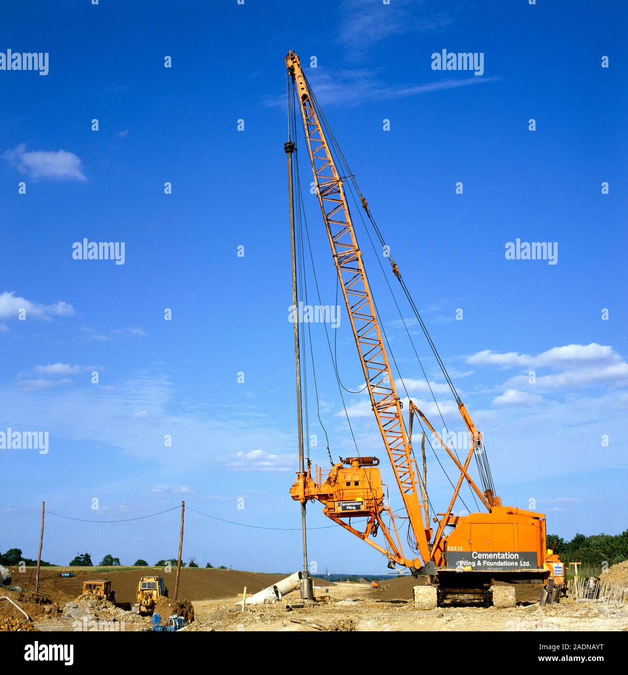 A pile driver, used to pile the foundations of a concrete bridge over a ...