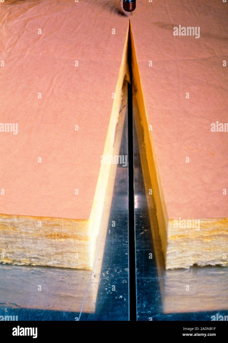Glass wool cutting. Waterjet cutting a block of glass wool to size for ...