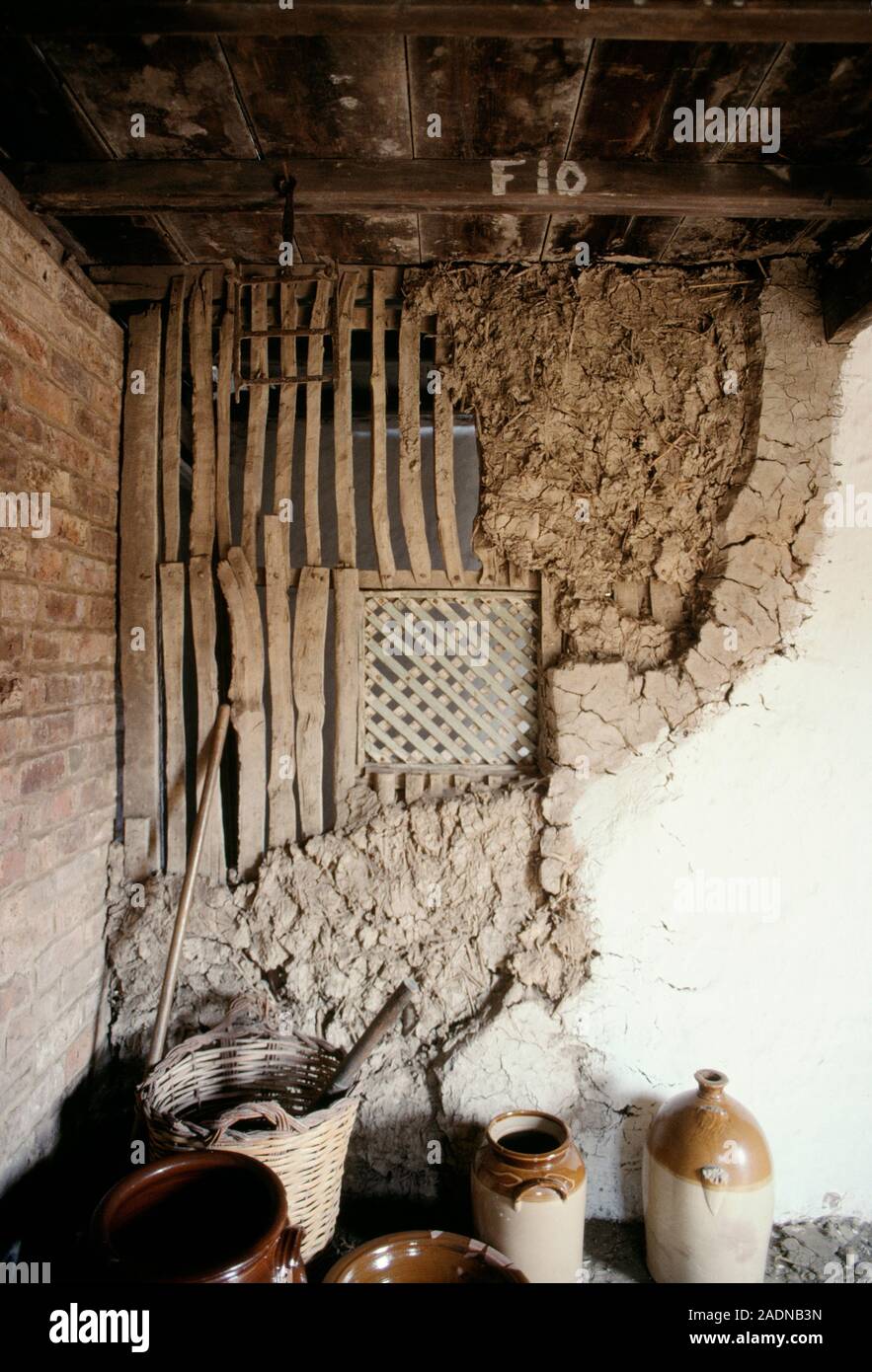 Wall structure. Half-built mud wall and the layers used in its ...