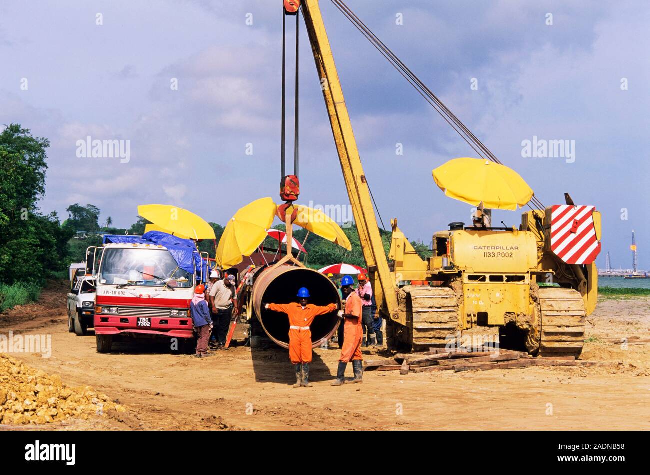 Gas line construction. Workers constructing a gas line. They have set ...