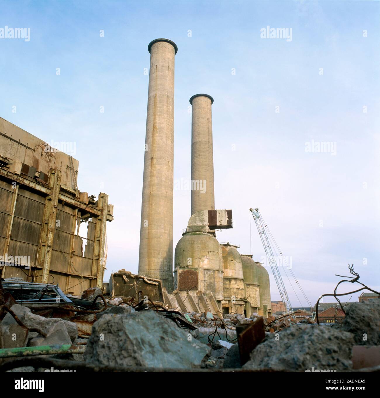 Power station demolition. Rubble surrounding smokestacks at a disused ...