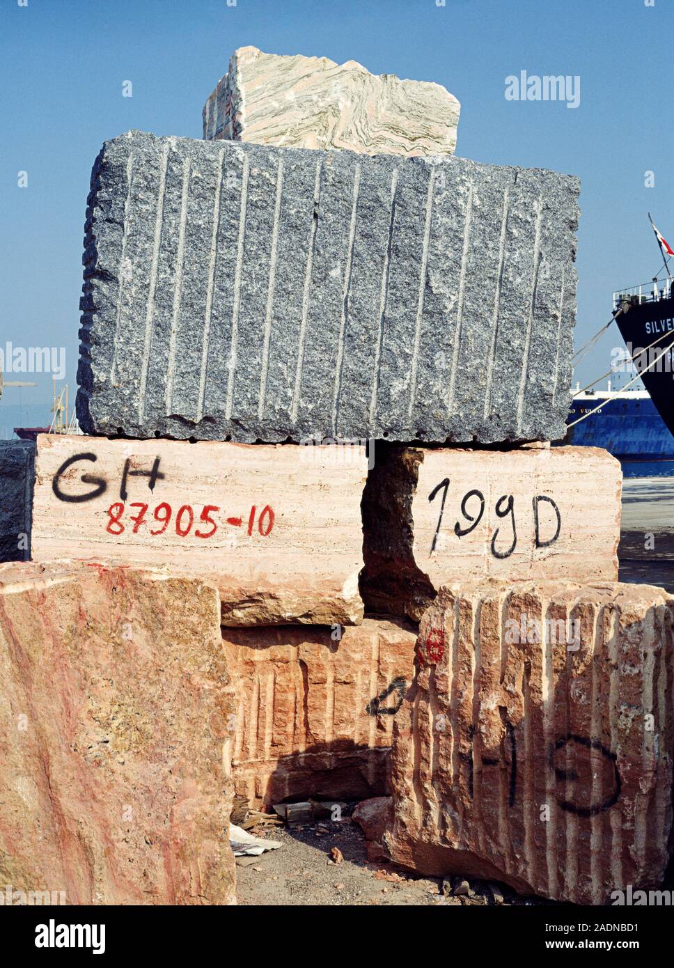 Blocks of dimension stone. Dimension stones stacked in a harbour. The ...