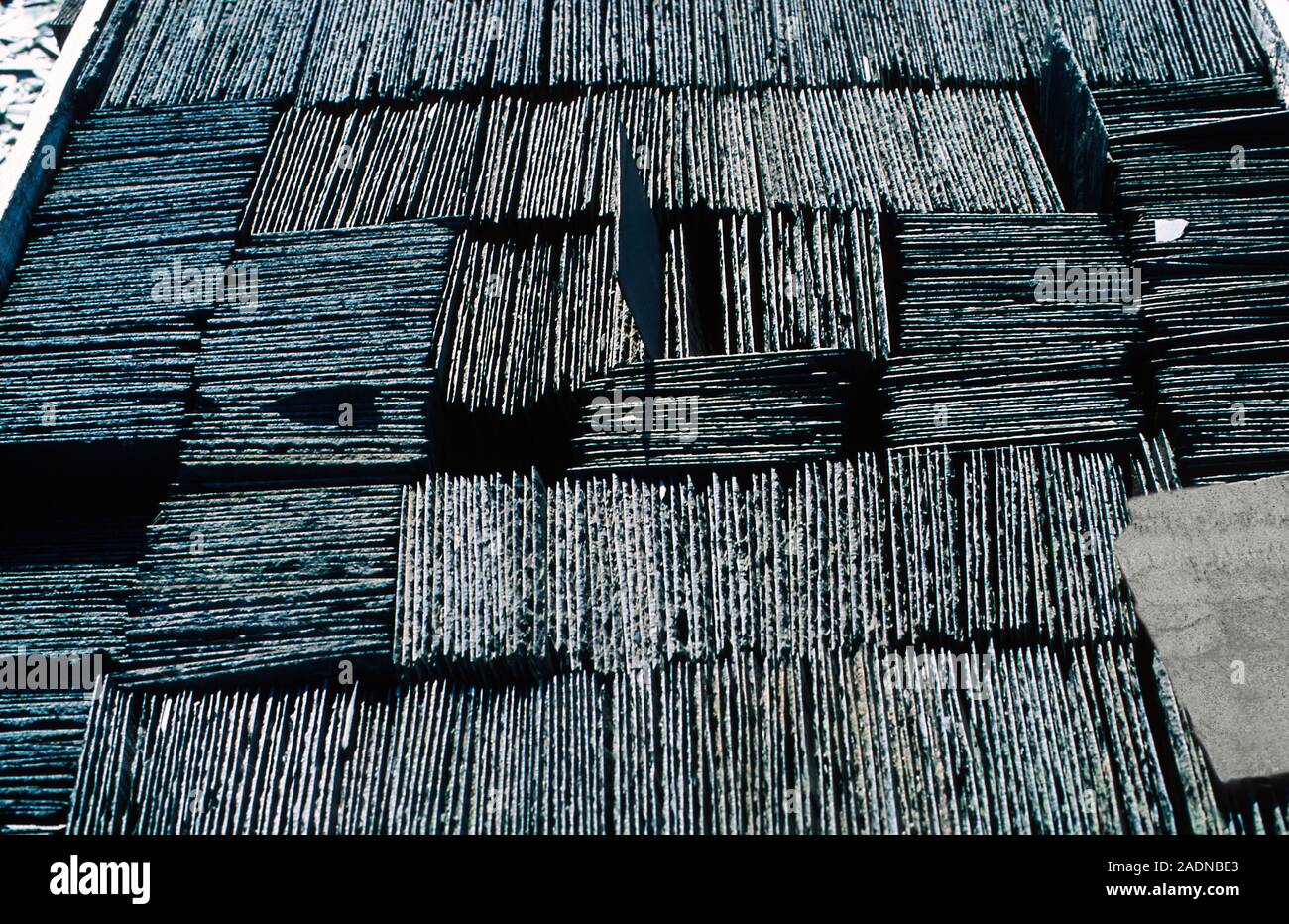 Slate tiles packed in a crate. Slate, a metamorphic rock, is formed ...
