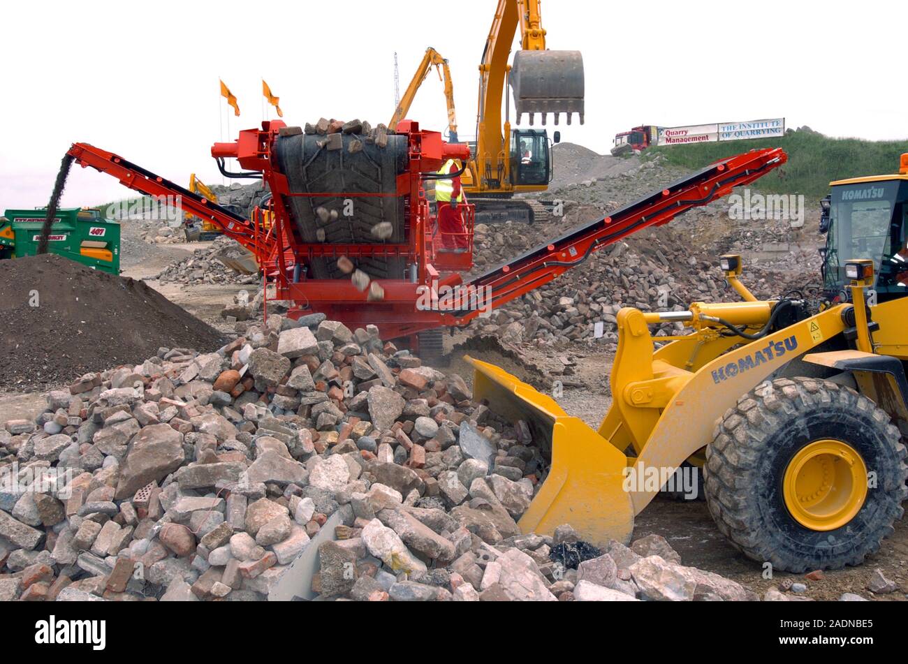 Quarry clearing. Diggers clearing rubble from a quarry Stock Photo - Alamy