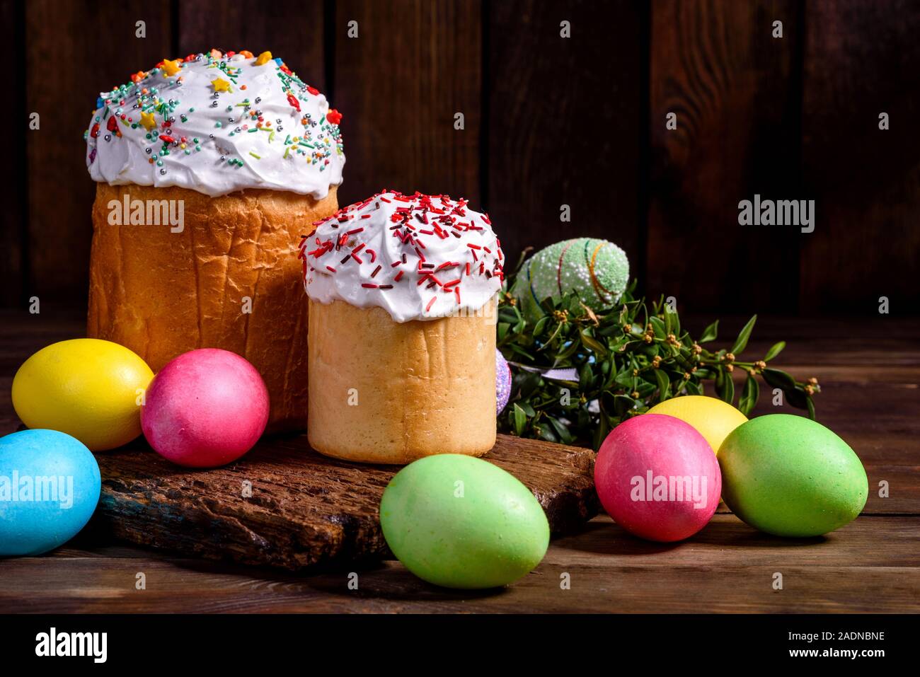 Easter cake and colorful eggs on a dark background. It can be used as a ...