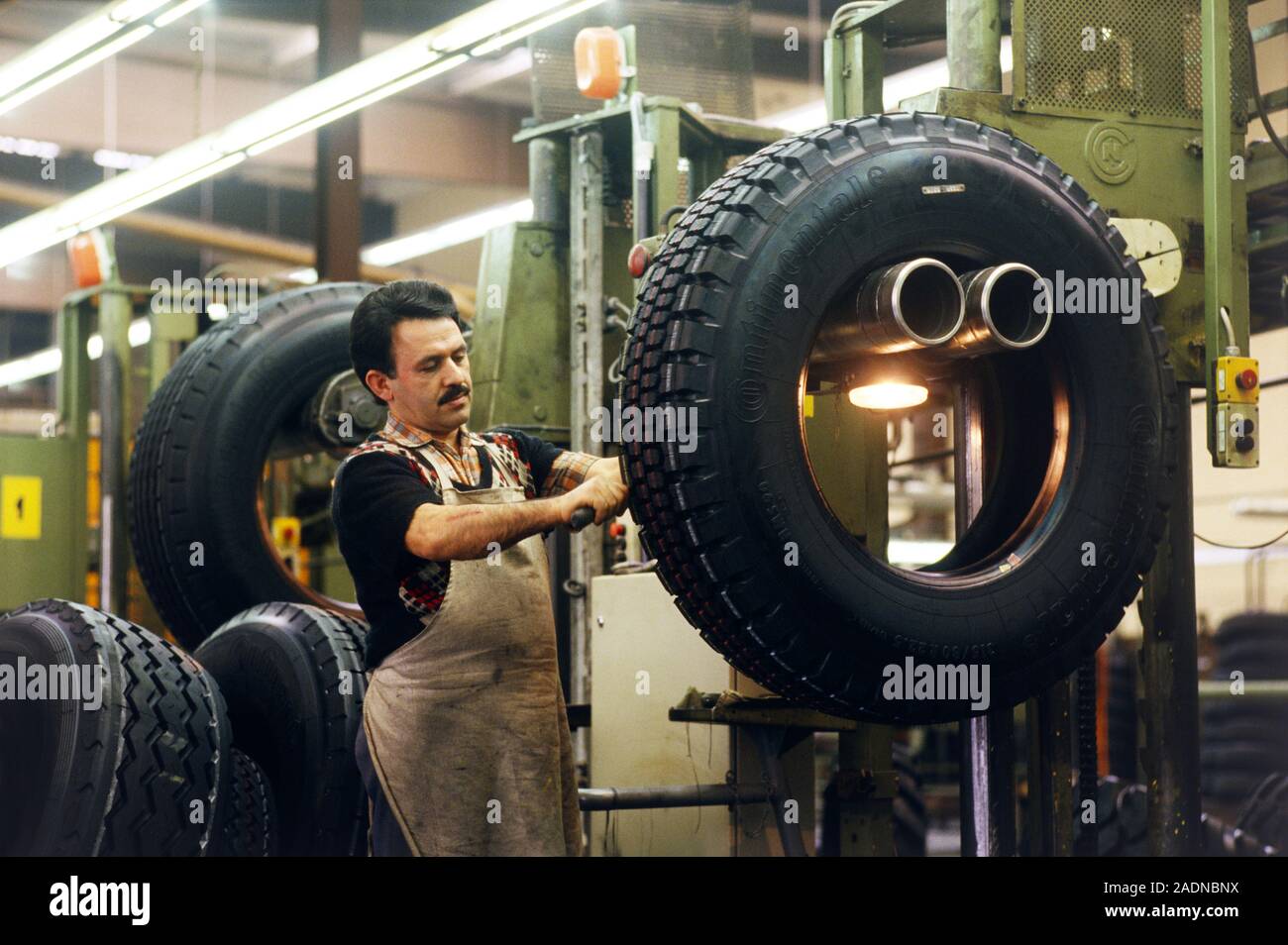 MODEL RELEASED. Quality control in a tyre factory Stock Photo - Alamy