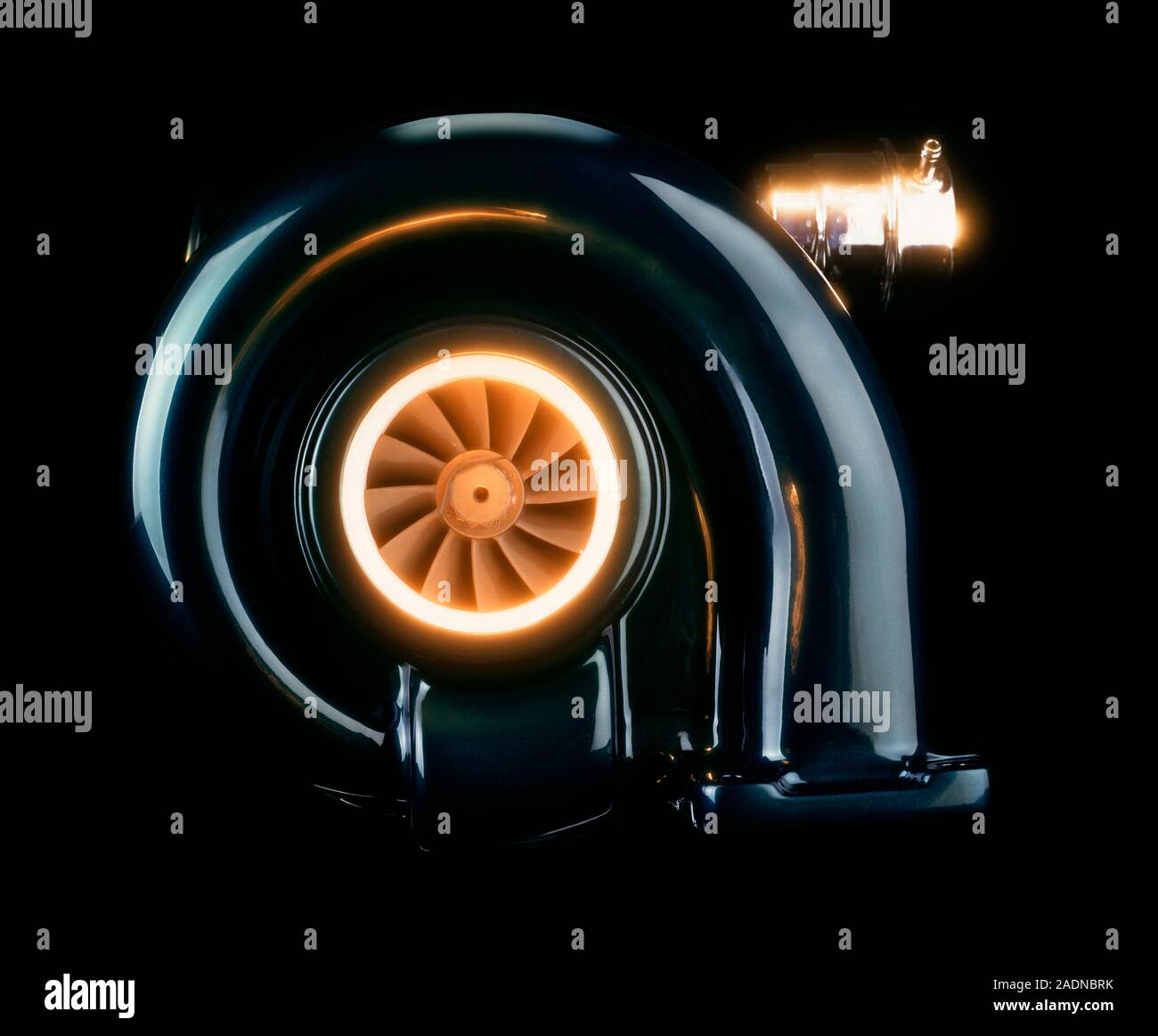Turbocharger. Cut away turbocharger showing turbine blades. This device ...