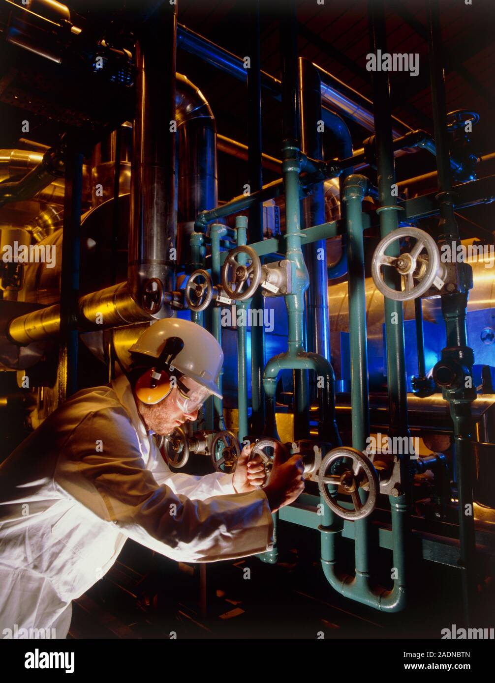 Engineer attending to part of the pipework complex at The BOC Group's ...