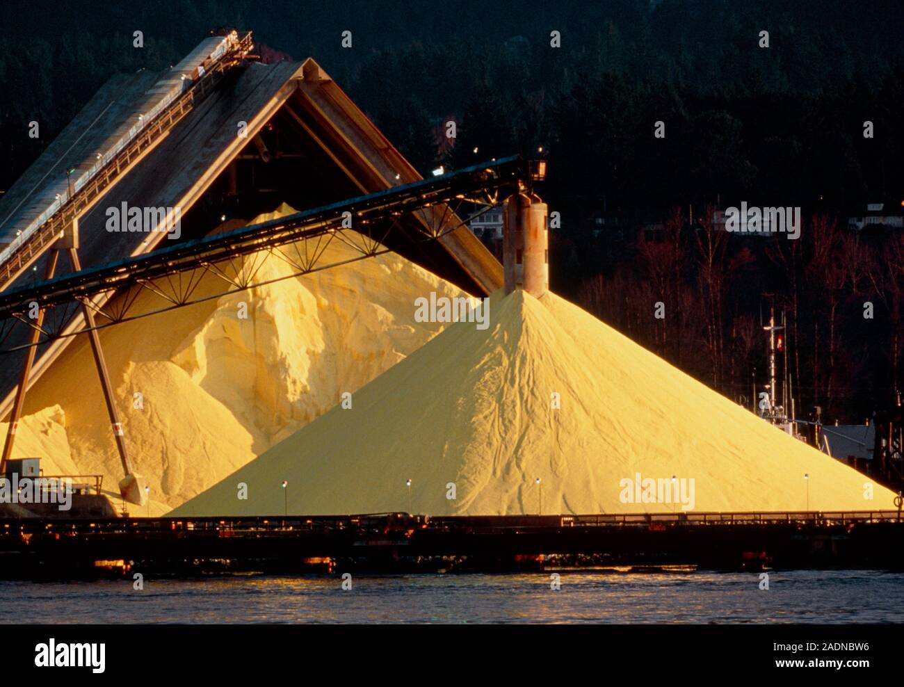 Piles of sulphur at a chemical plant. Sulphur may be obtained from ...