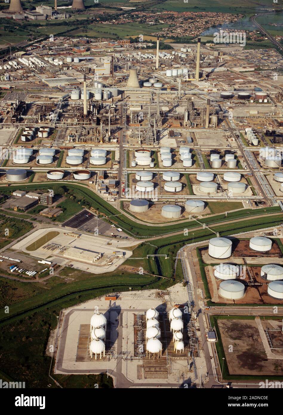 Chemical plant. Aerial view of the reactor towers (background) and ...