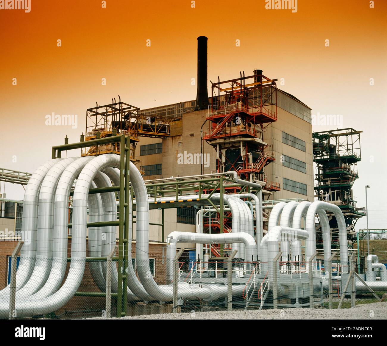 Chemical factory. External steam pipes with expansion loops at a ...