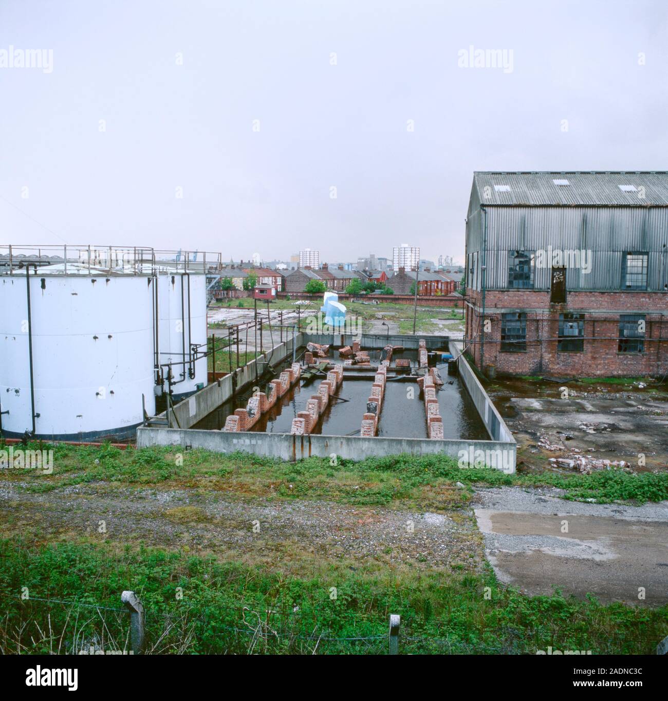 Abandoned tar factory. Gas storage tanks are seen at left. Some tars ...