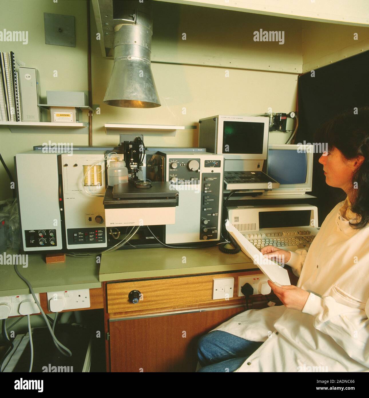 A researcher using an atomic absorption spectrometer at the British ...