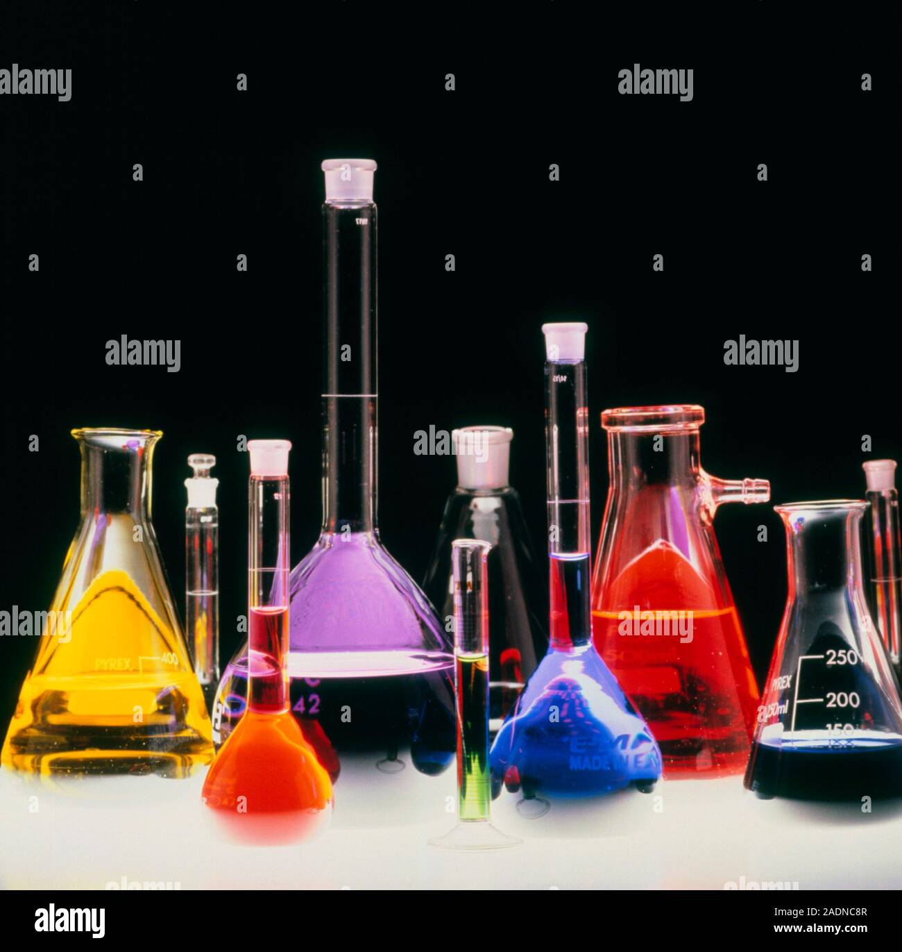 Chemical flasks. Assortment of laboratory flasks and a measuring ...