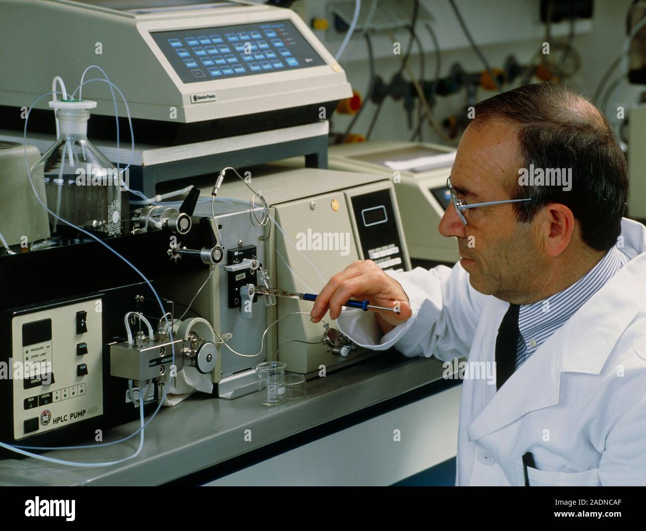 Liquid chromatography. Chemist in a laboratory with high-pressure ...