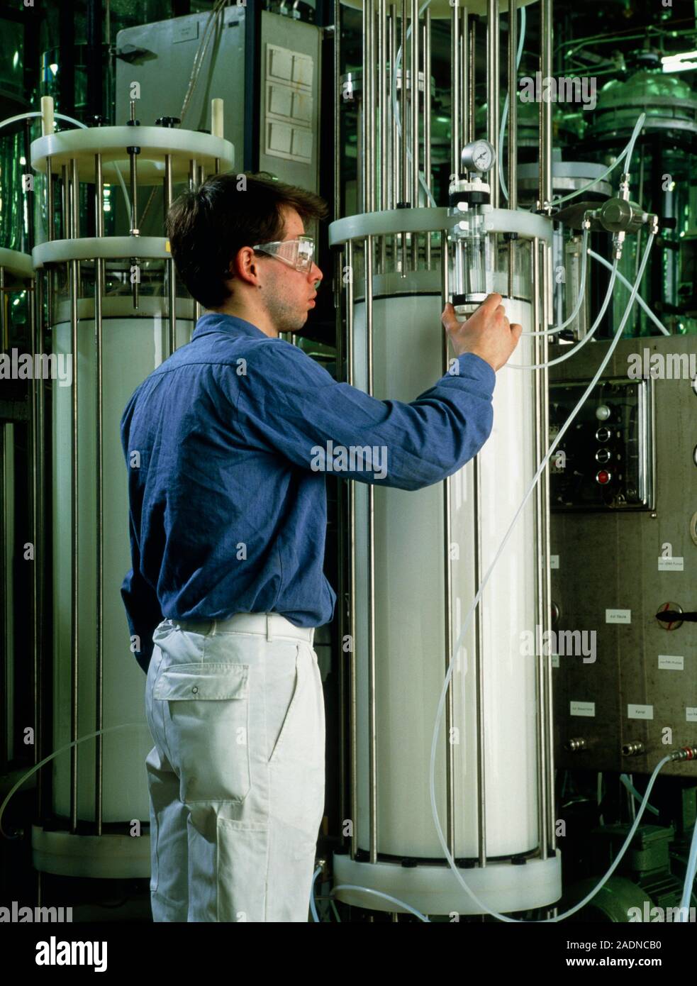 Chromatography. Scientist with column chromatography equipment. Column ...