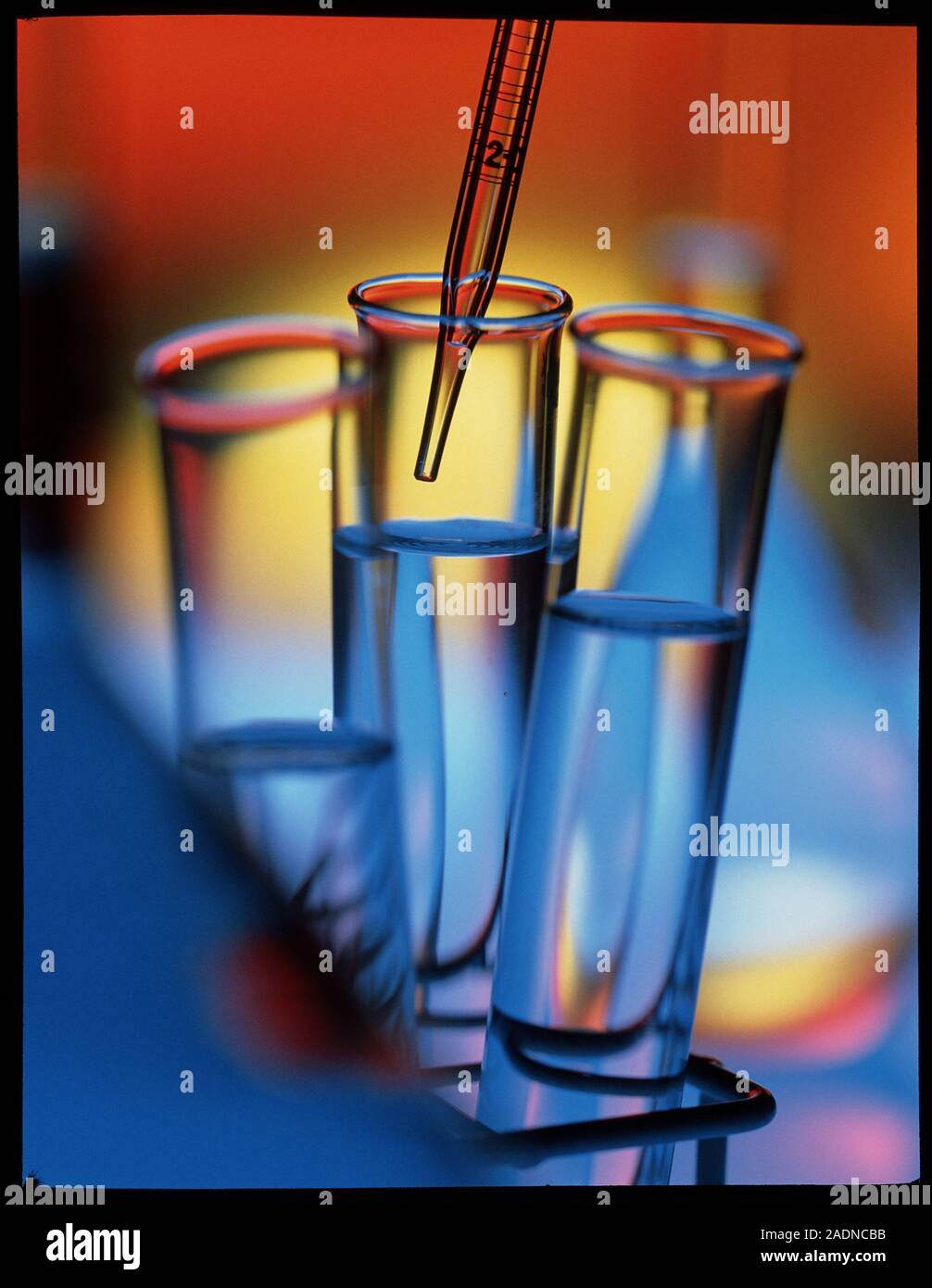 Pipette & test tubes. Pipette places a chemical solution into a test ...