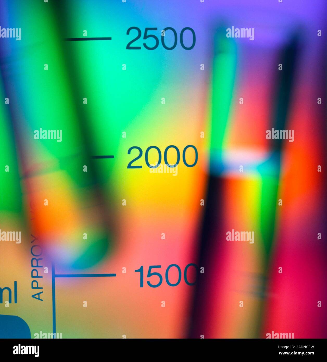 Laboratory glassware. View of two test tubes seen through a beaker. The ...