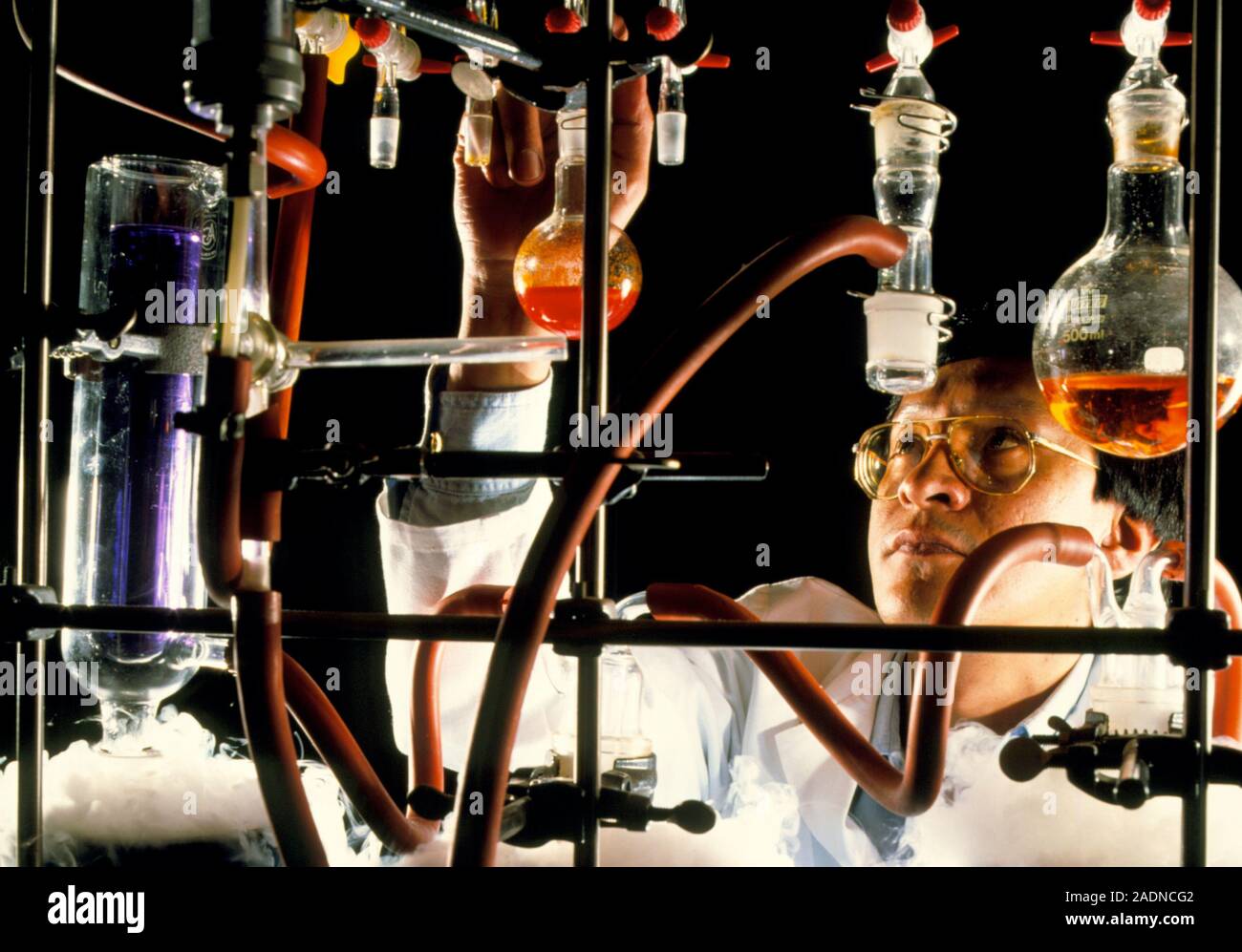 Chemistry research. Male research chemist in laboratory. The chemist is ...