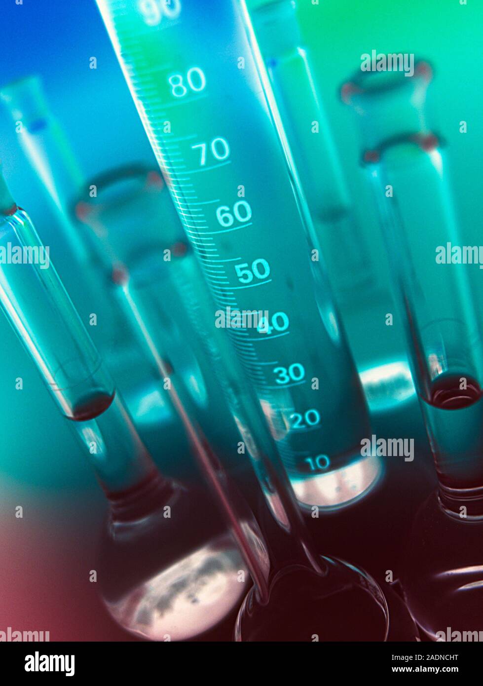 Laboratory glassware. Assortment of laboratory glassware. A graduated ...