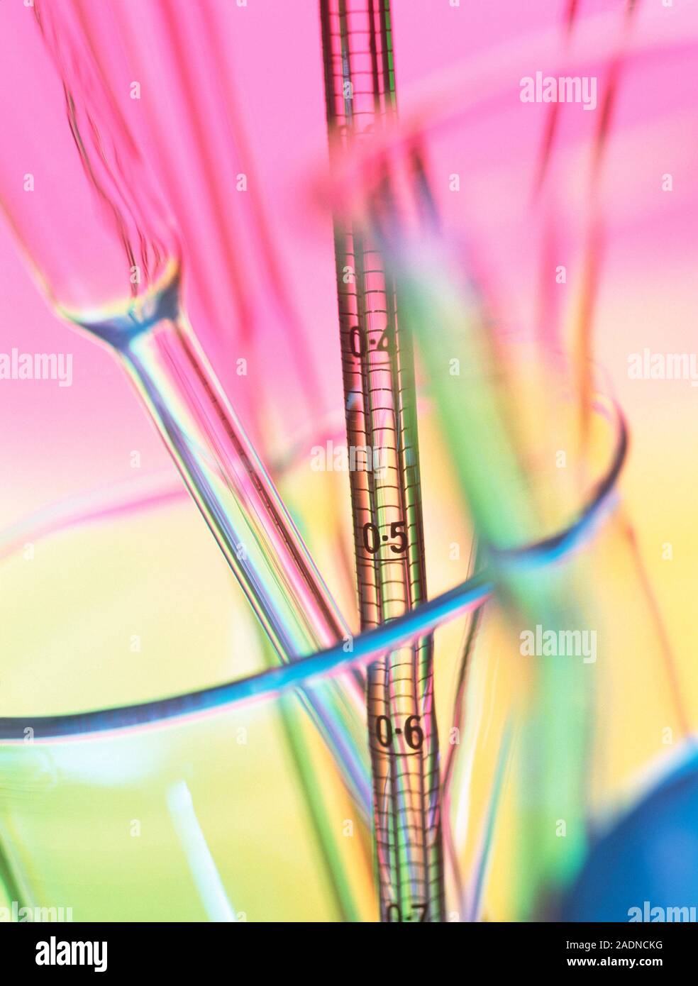 Laboratory glassware. Pipettes in a beaker seen behind a flask Stock ...