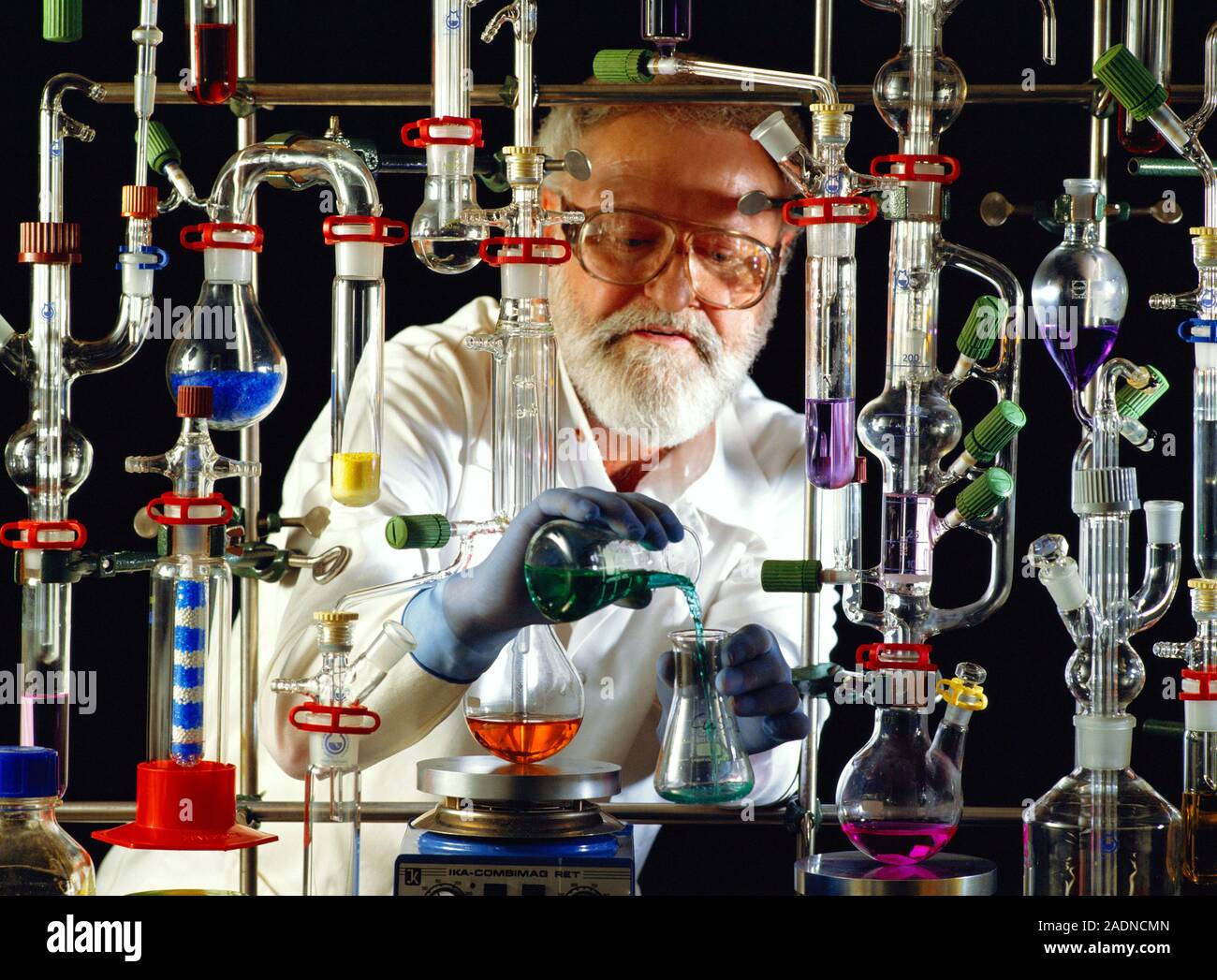 Chemistry laboratory. Researcher carrying out a complex chemistry ...