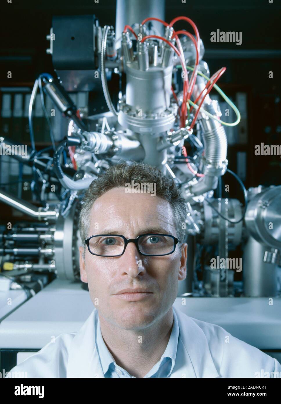 Mass spectrometry. Physicist in front of a time of flight secondary ion ...