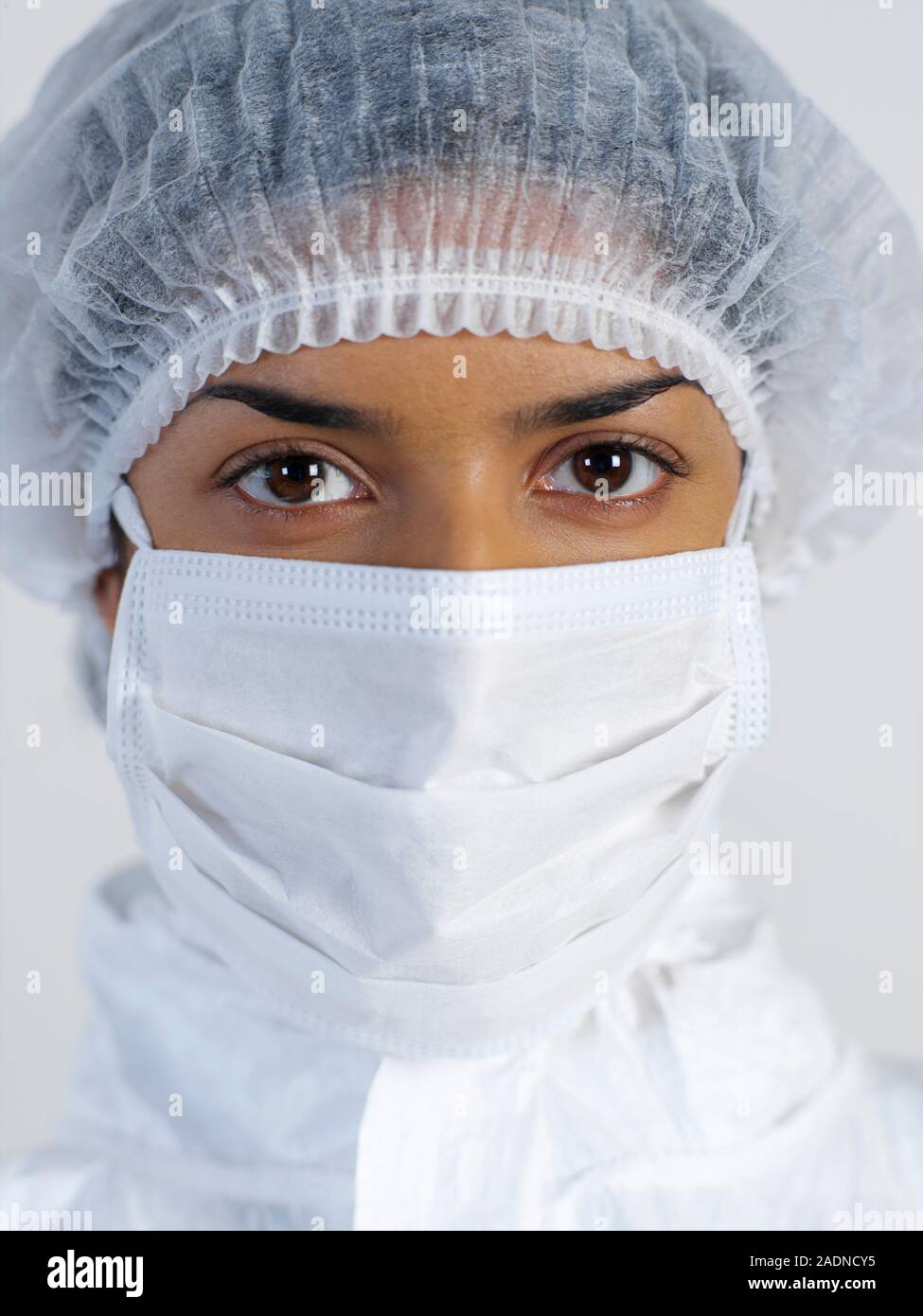 Laboratory technician wearing protective clothing Stock Photo - Alamy